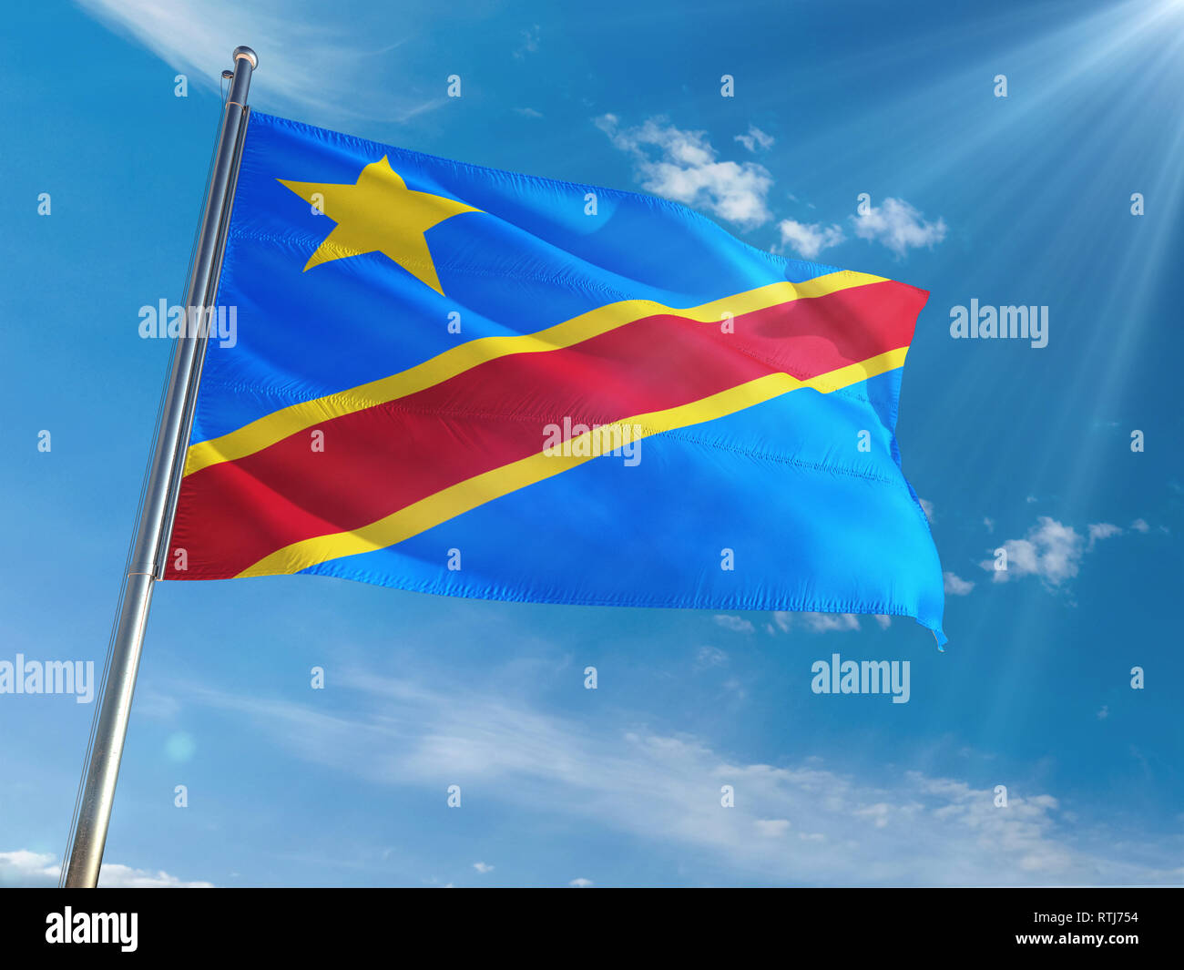 Congo National Flag Waving on pole against sunny blue sky background ...