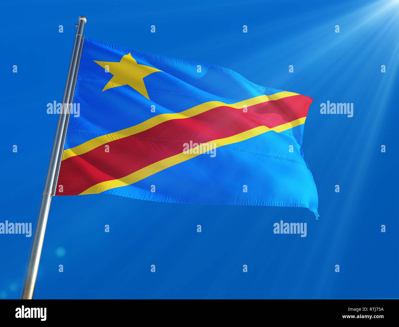 Congo National Flag Waving on pole against deep blue sky background ...