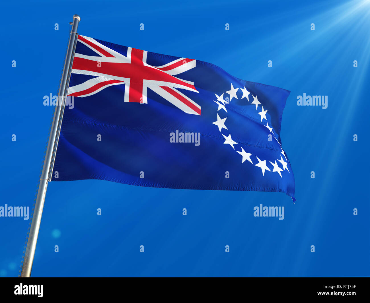 Cook Islands National Flag Waving on pole against deep blue sky ...