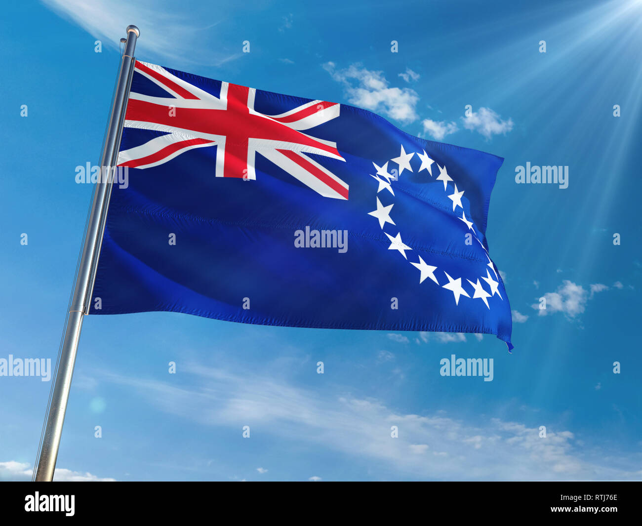 Cook Islands National Flag Waving on pole against sunny blue sky ...