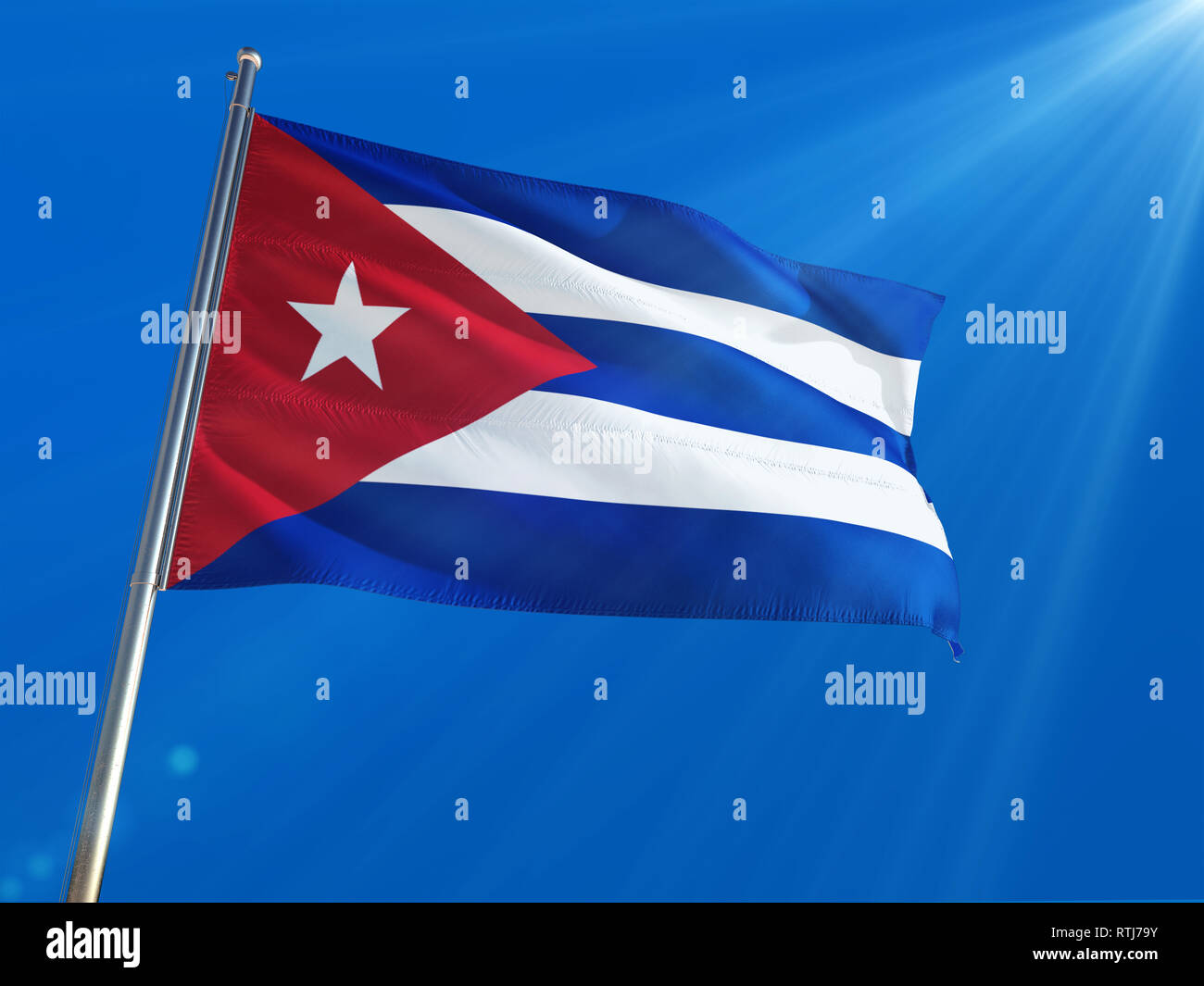 Cuba National Flag Waving on pole against deep blue sky background ...