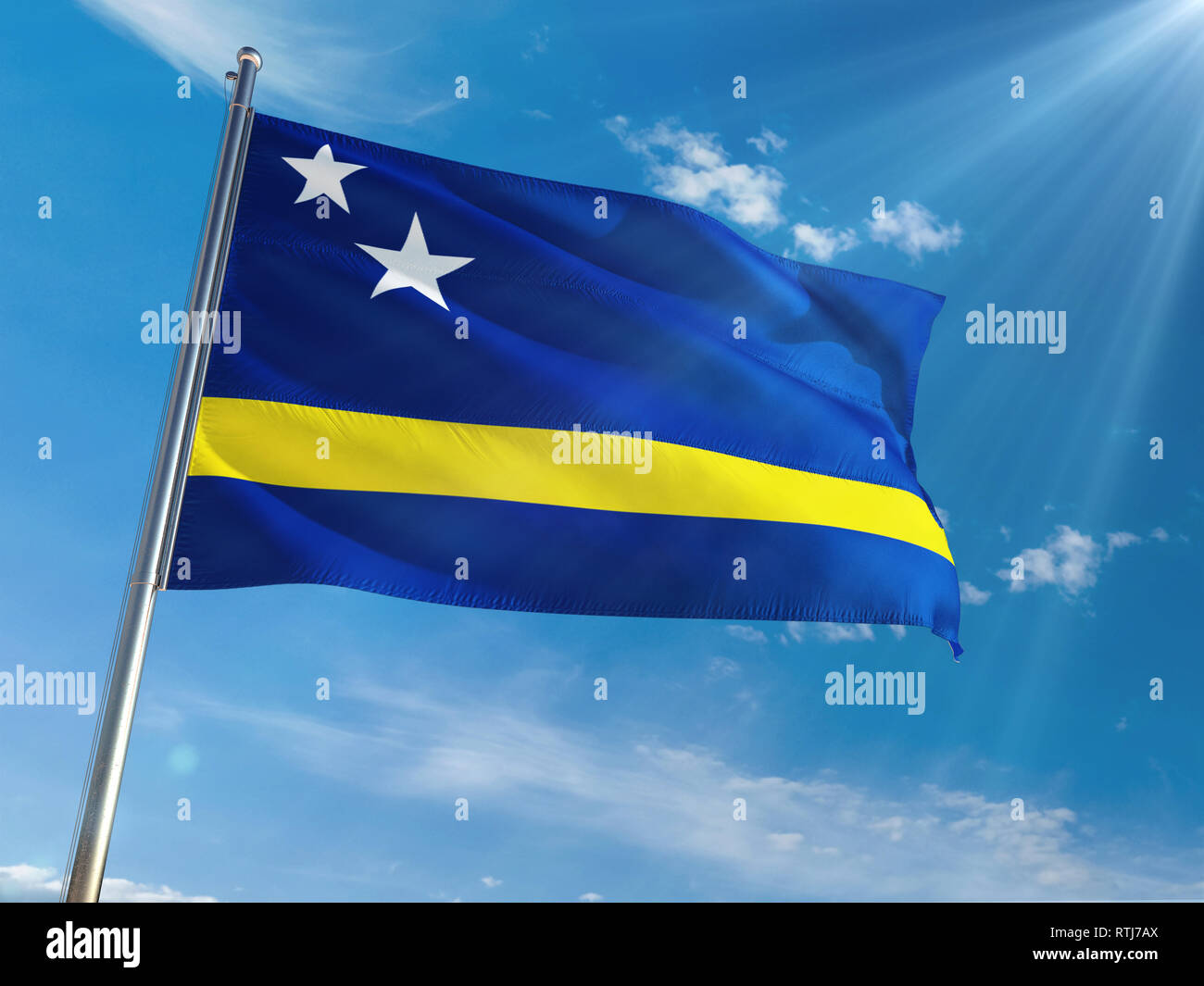 Curacao National Flag Waving on pole against sunny blue sky background ...