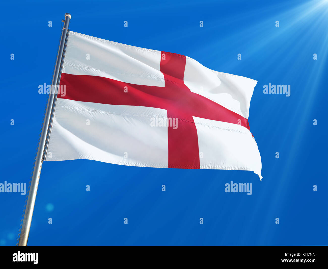 England National Flag Waving on pole against deep blue sky background ...