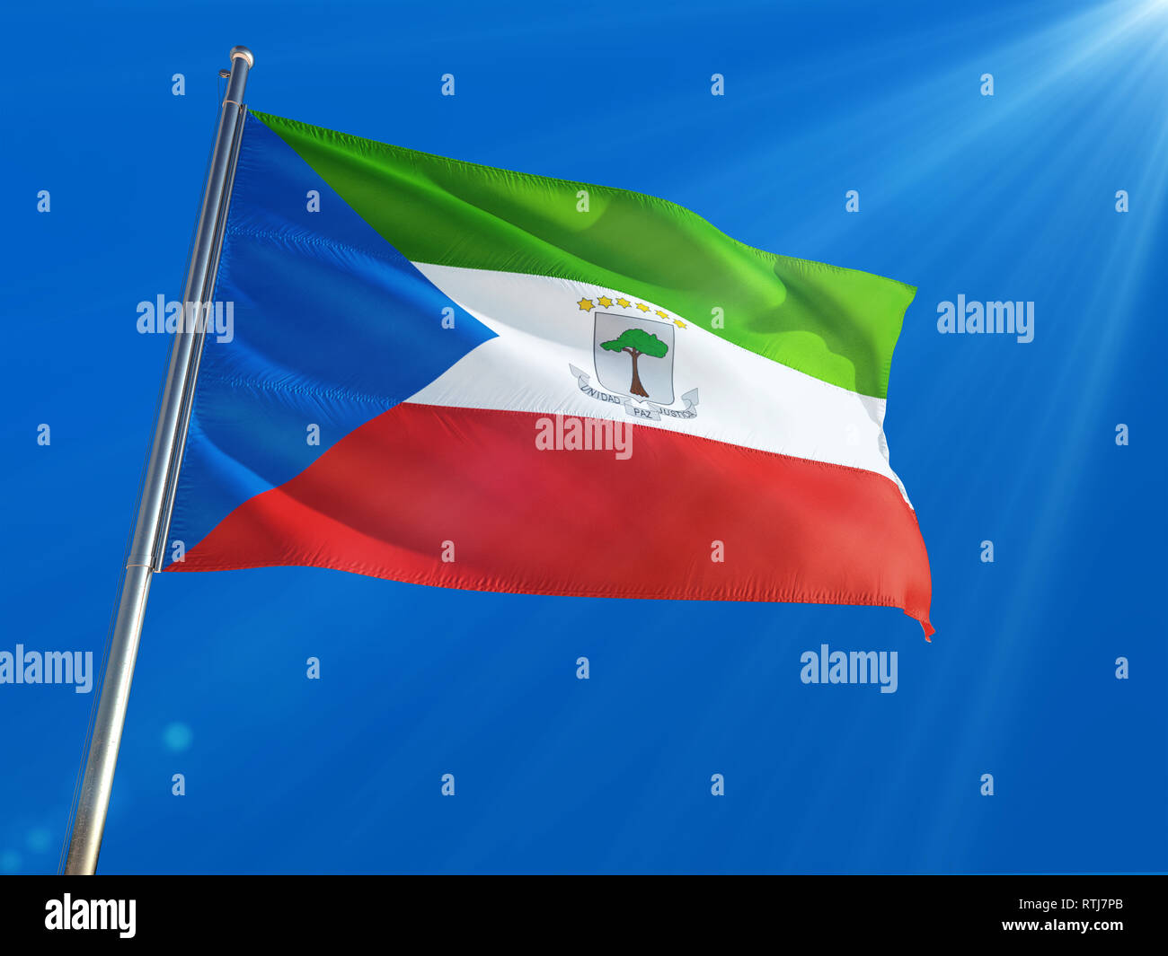 Equatorial Guinea National Flag Waving on pole against deep blue sky ...