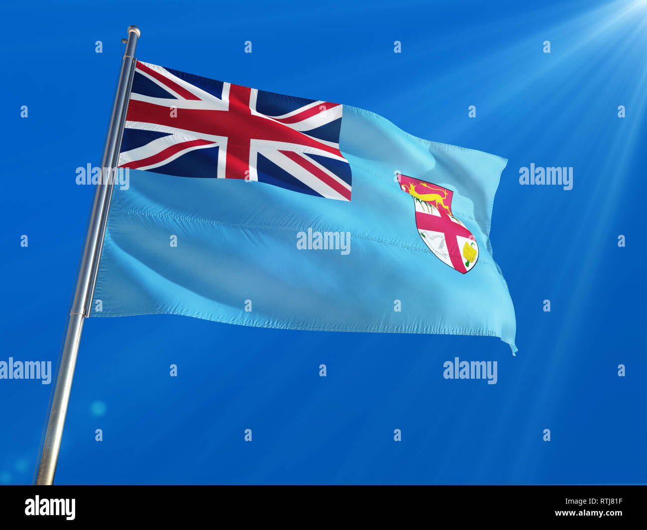 Fiji National Flag Waving on pole against deep blue sky background. High Definition Stock Photo ...