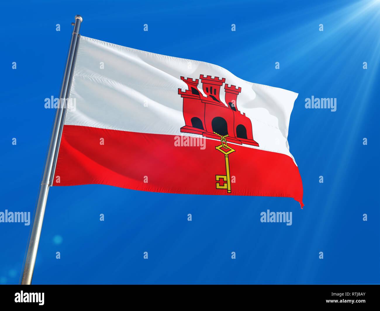 Gibraltar National Flag Waving on pole against deep blue sky background ...