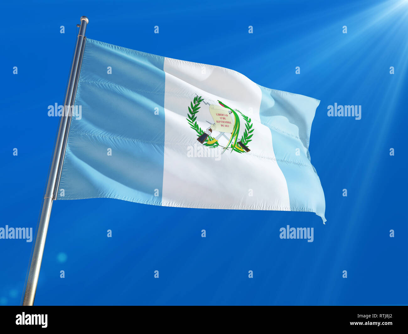 Guatemala National Flag Waving on pole against deep blue sky background ...