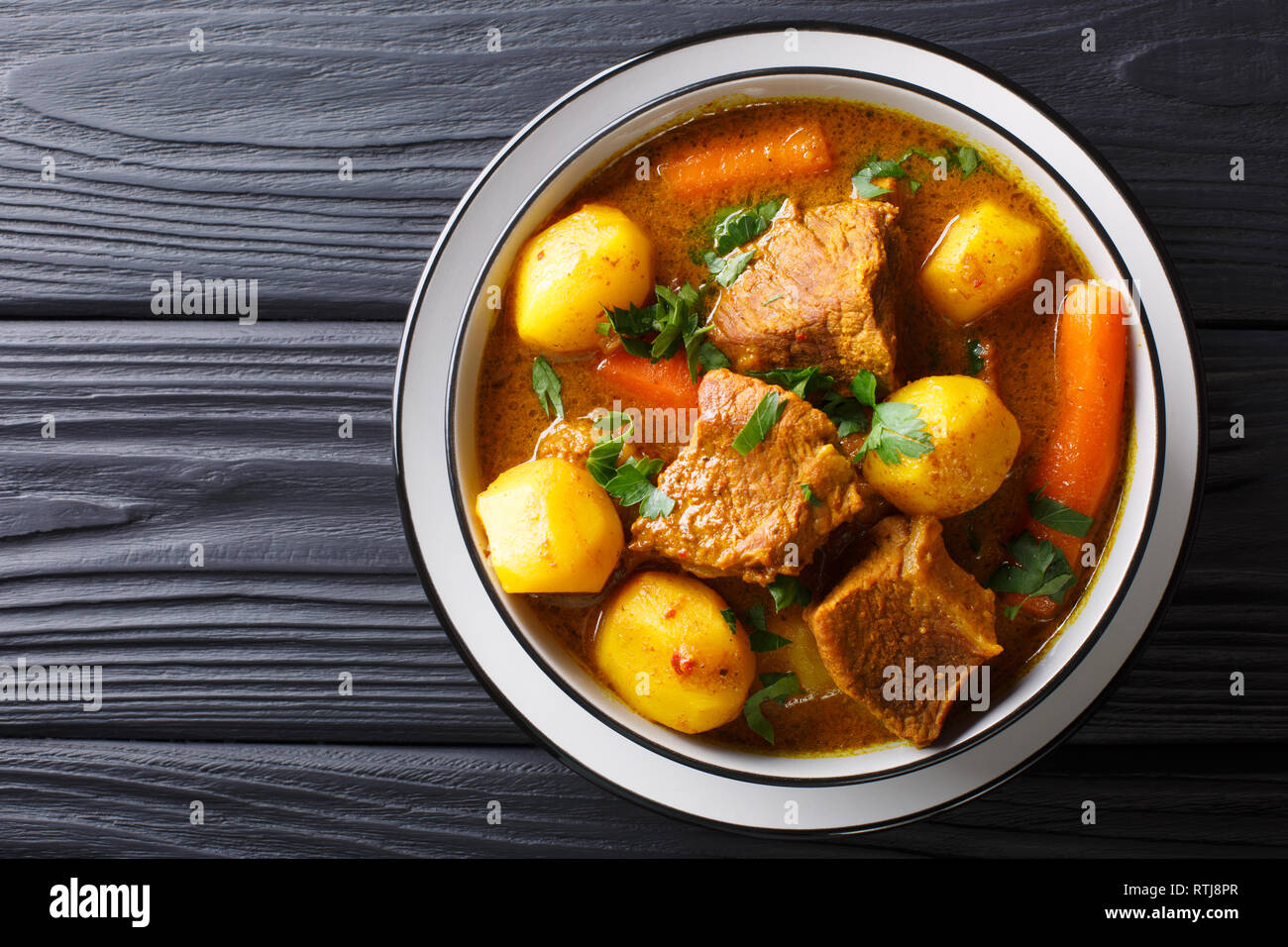 Namibia Potjiekos traditional lamb dish with vegetables close-up in a ...