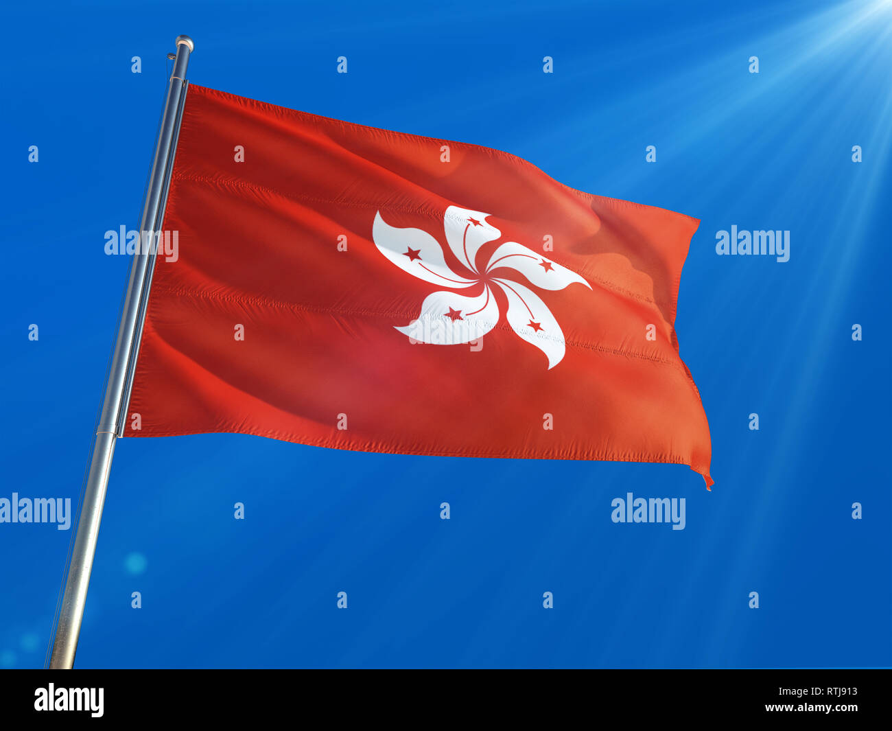 Hong Kong National Flag Waving on pole against deep blue sky background ...