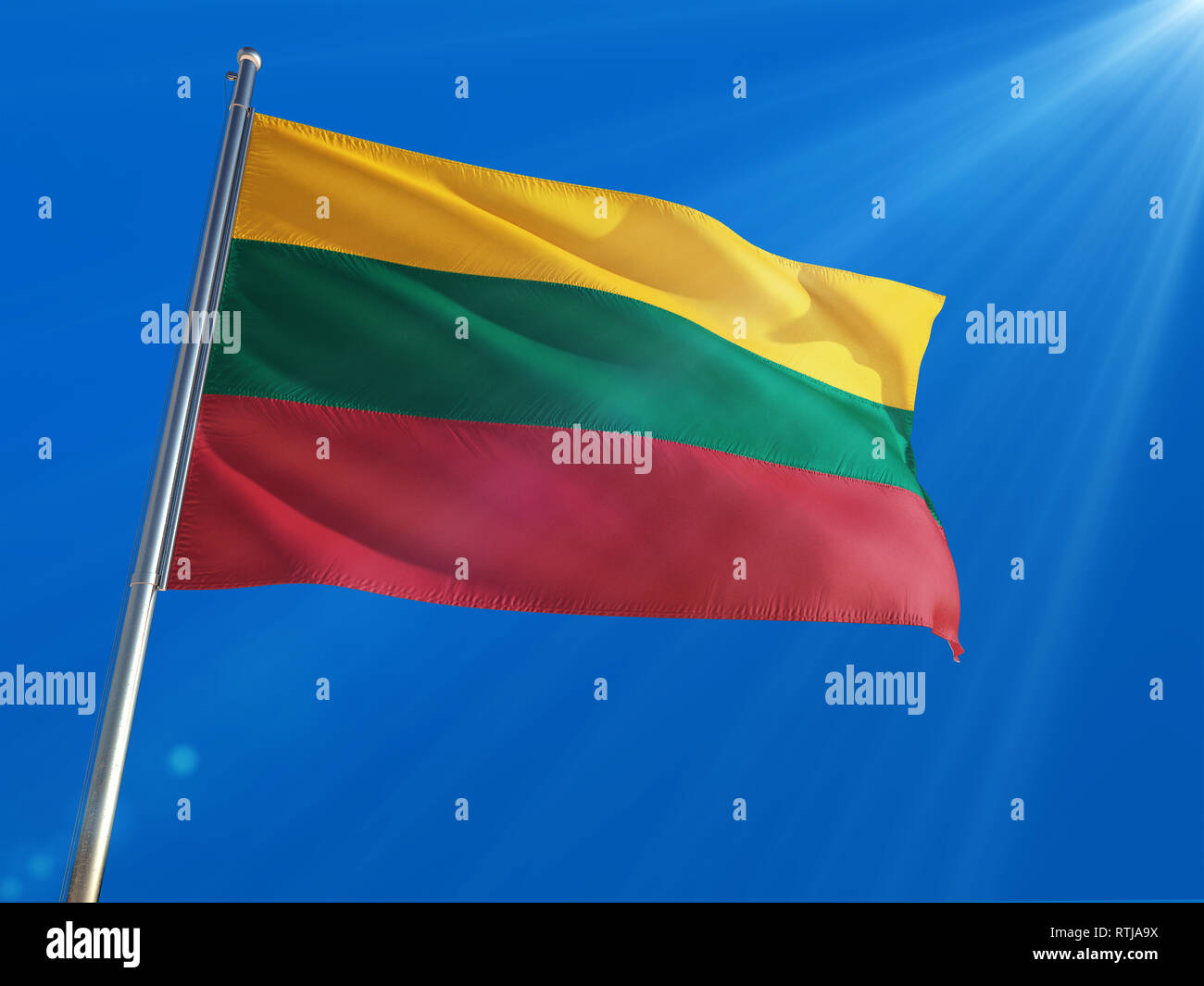 Lithuania National Flag Waving on pole against deep blue sky background ...