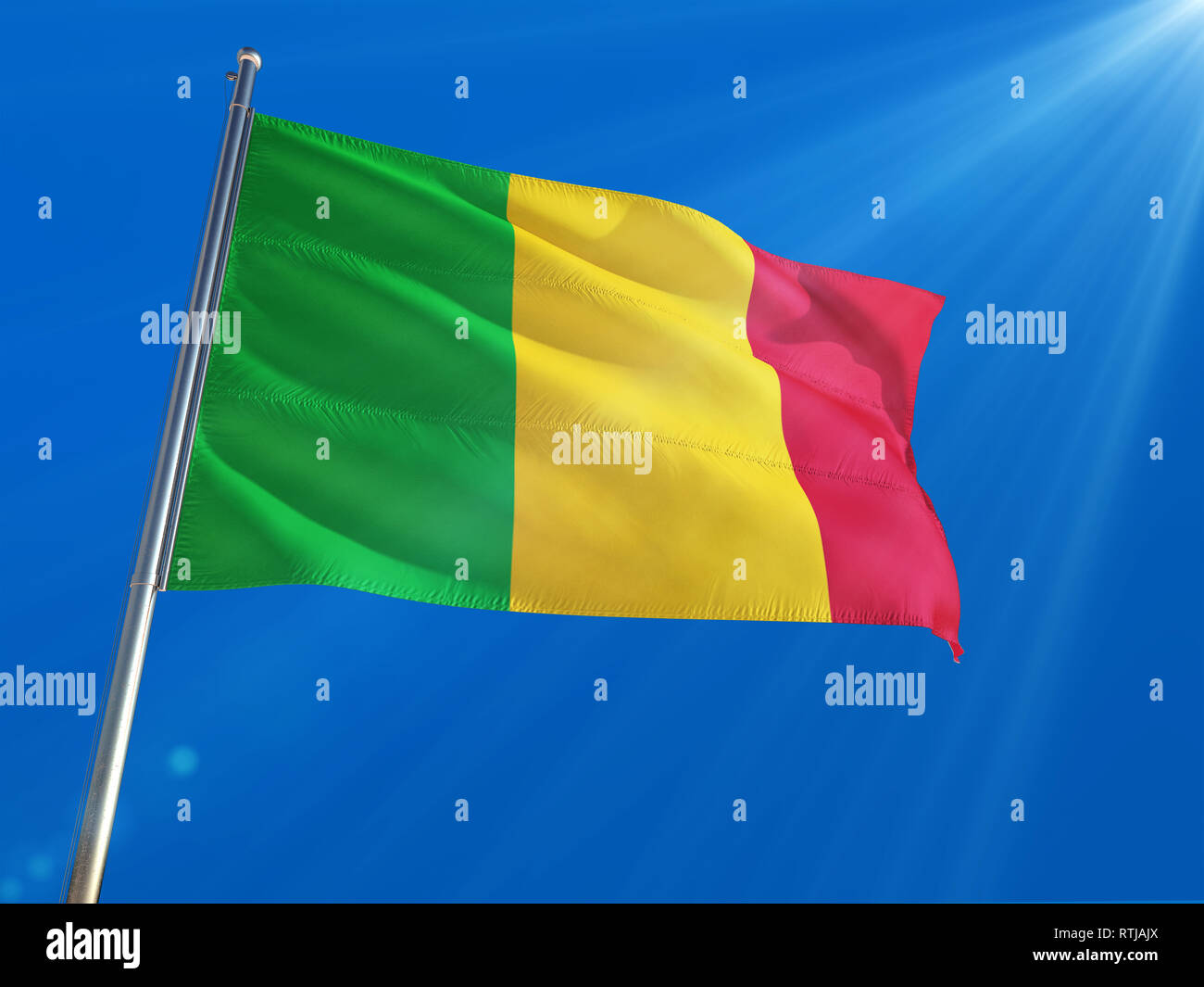 Mali National Flag Waving on pole against deep blue sky background ...