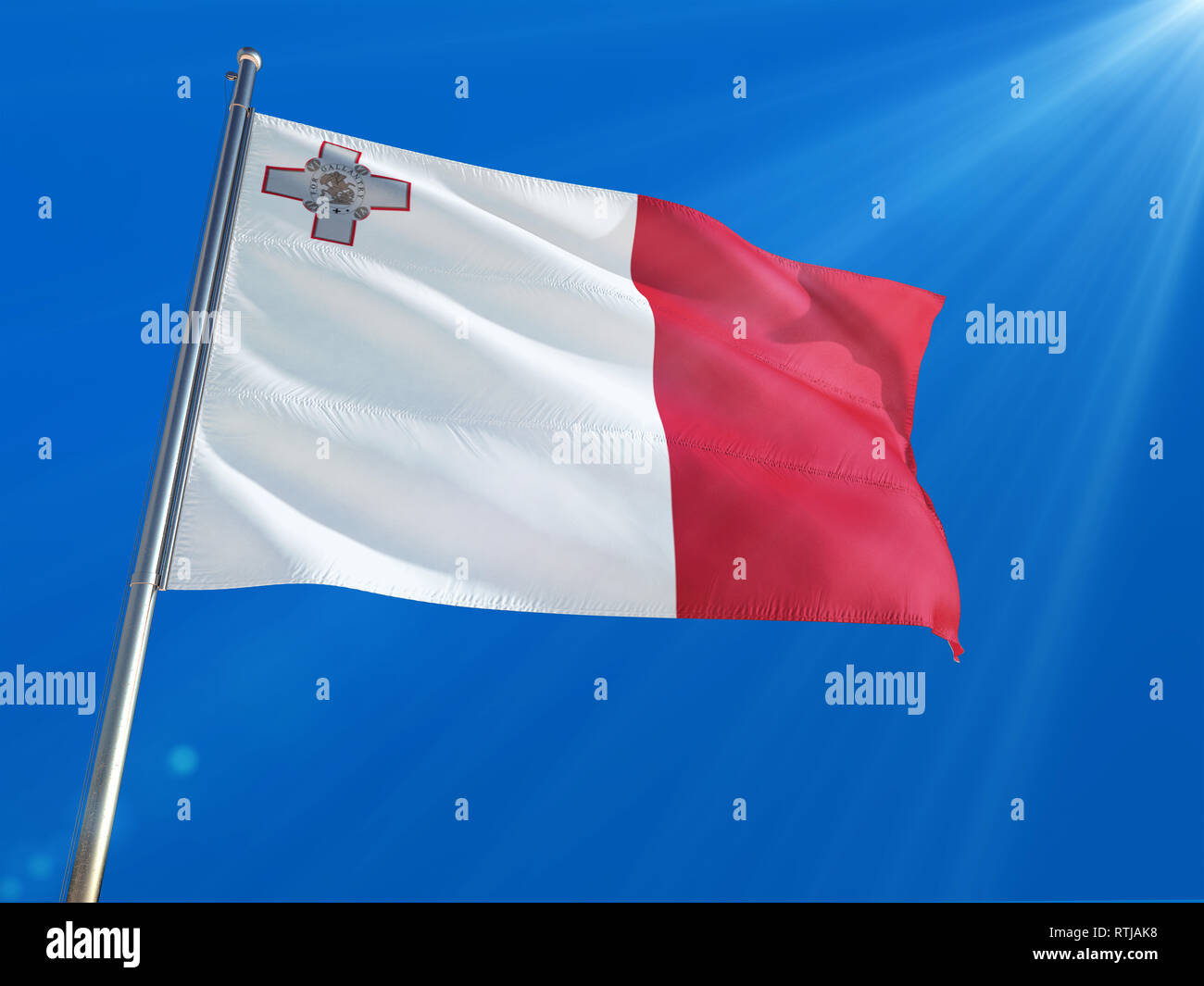 Malta National Flag Waving on pole against deep blue sky background ...