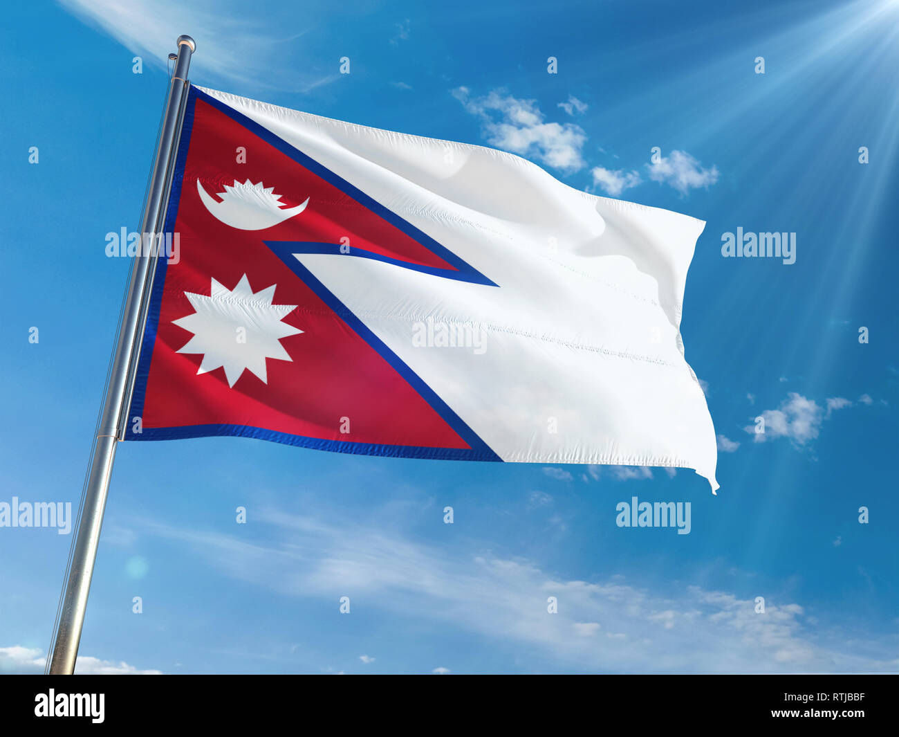 Nepal National Flag Waving on pole against sunny blue sky background ...