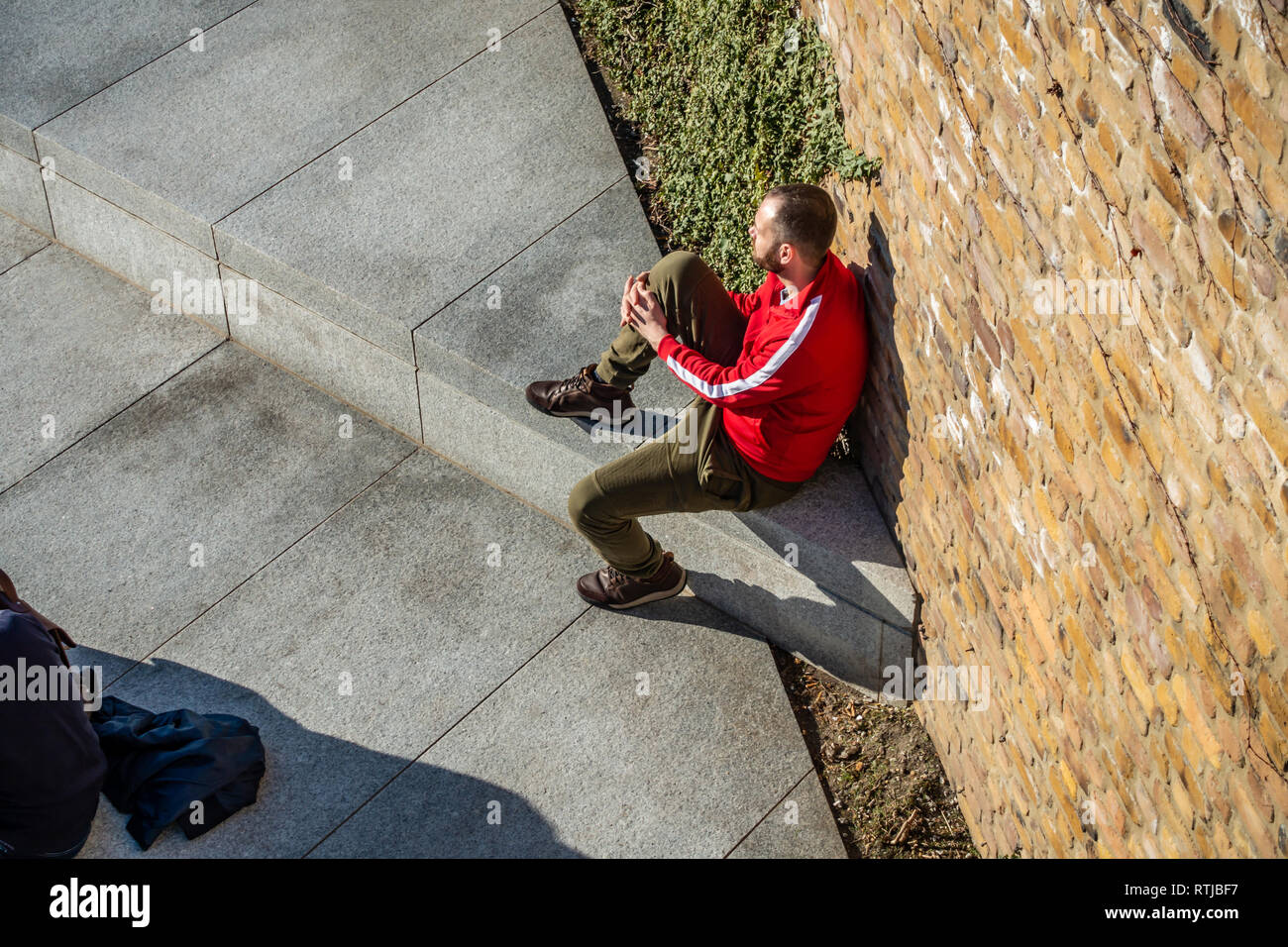 Student sitting on step hi-res stock photography and images - Alamy
