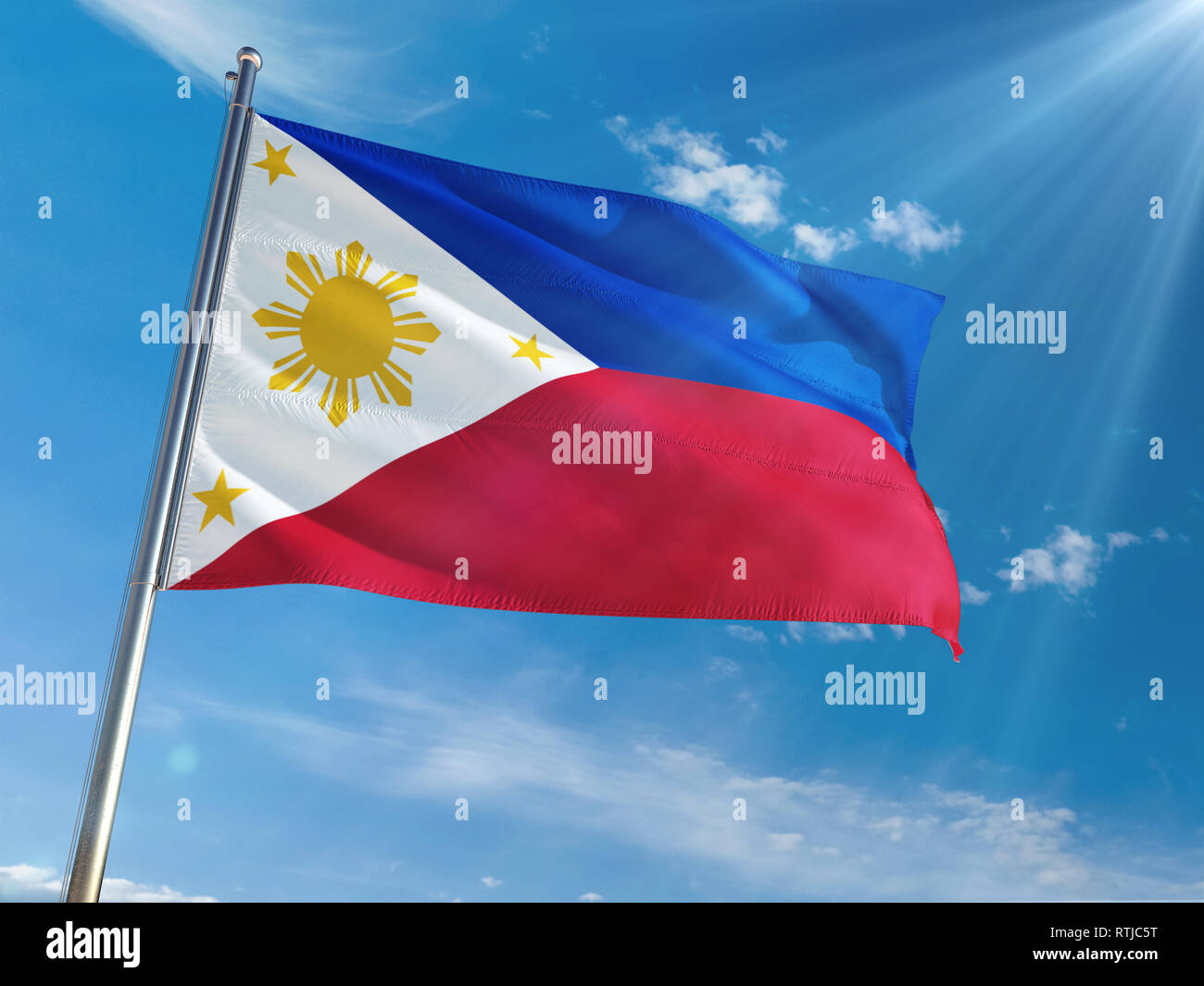 Philippines National Flag Waving on pole against sunny blue sky ...