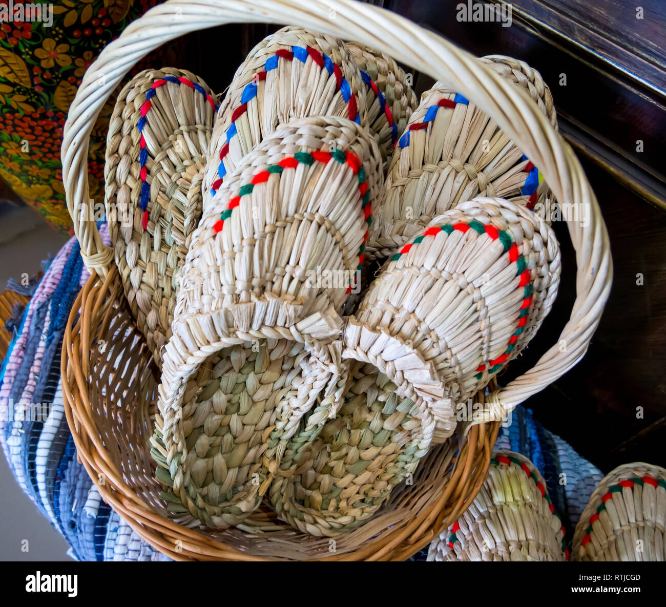 Wicker basket filled with Russian bast shoes Stock Photo - Alamy