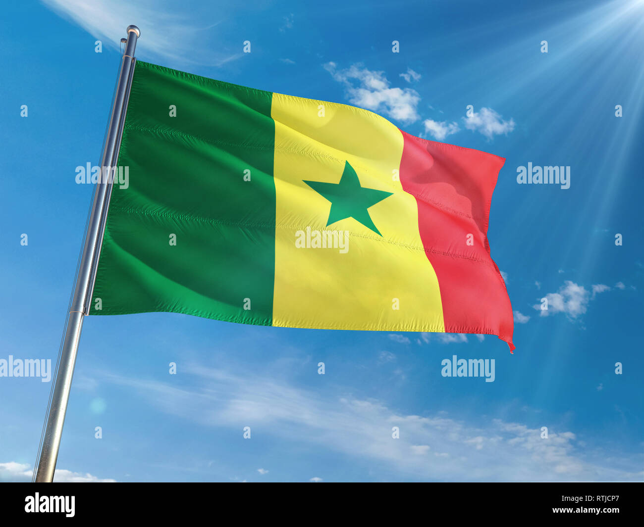 Senegal National Flag Waving on pole against sunny blue sky background ...