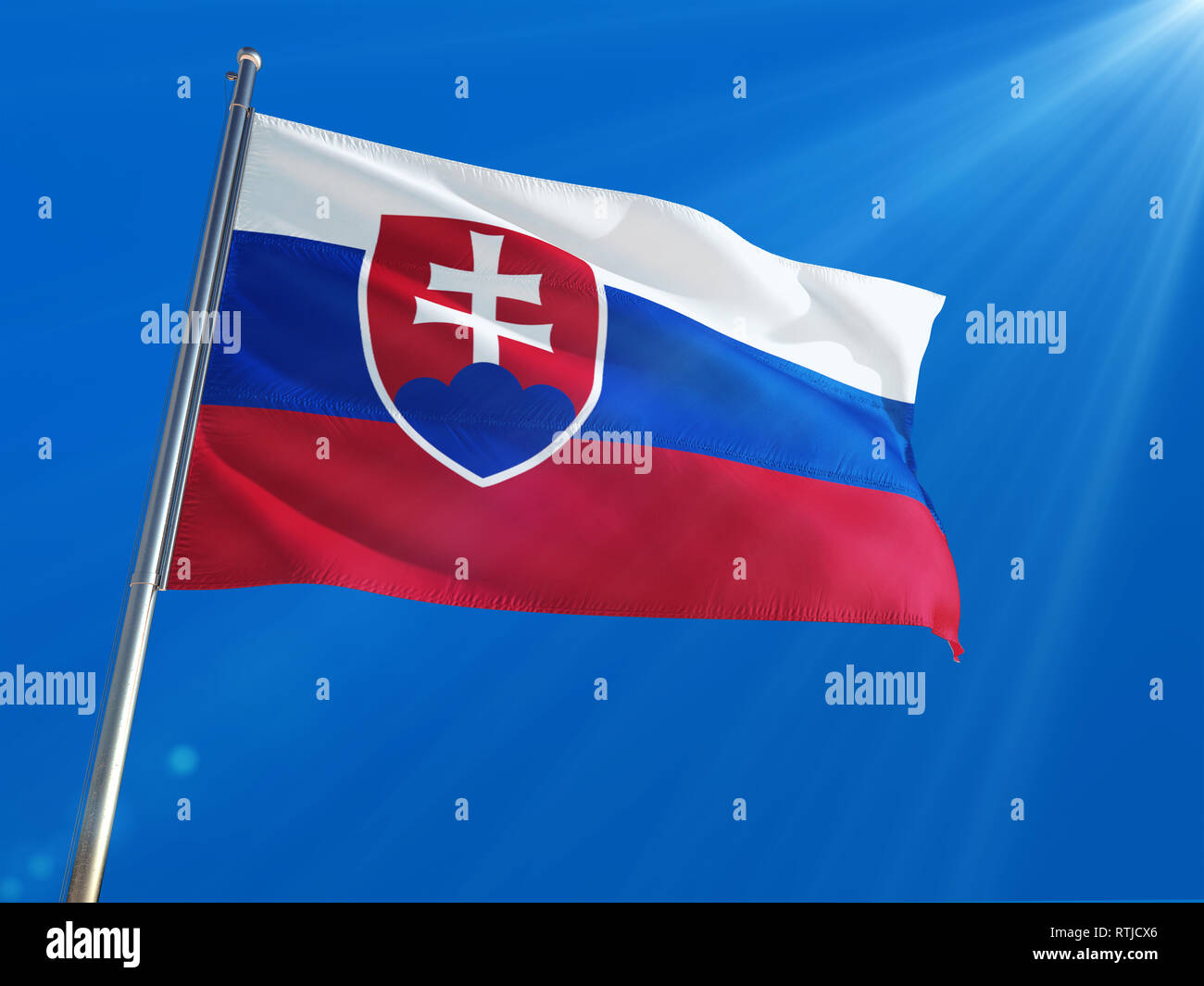 Slovakia National Flag Waving on pole against deep blue sky background ...