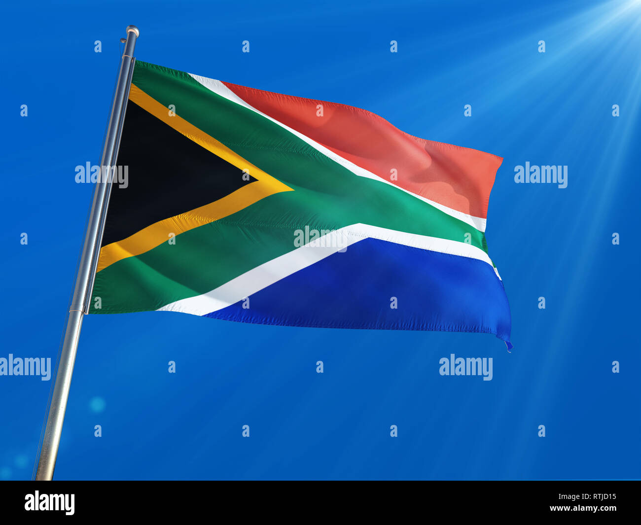 South Africa National Flag Waving on pole against deep blue sky ...