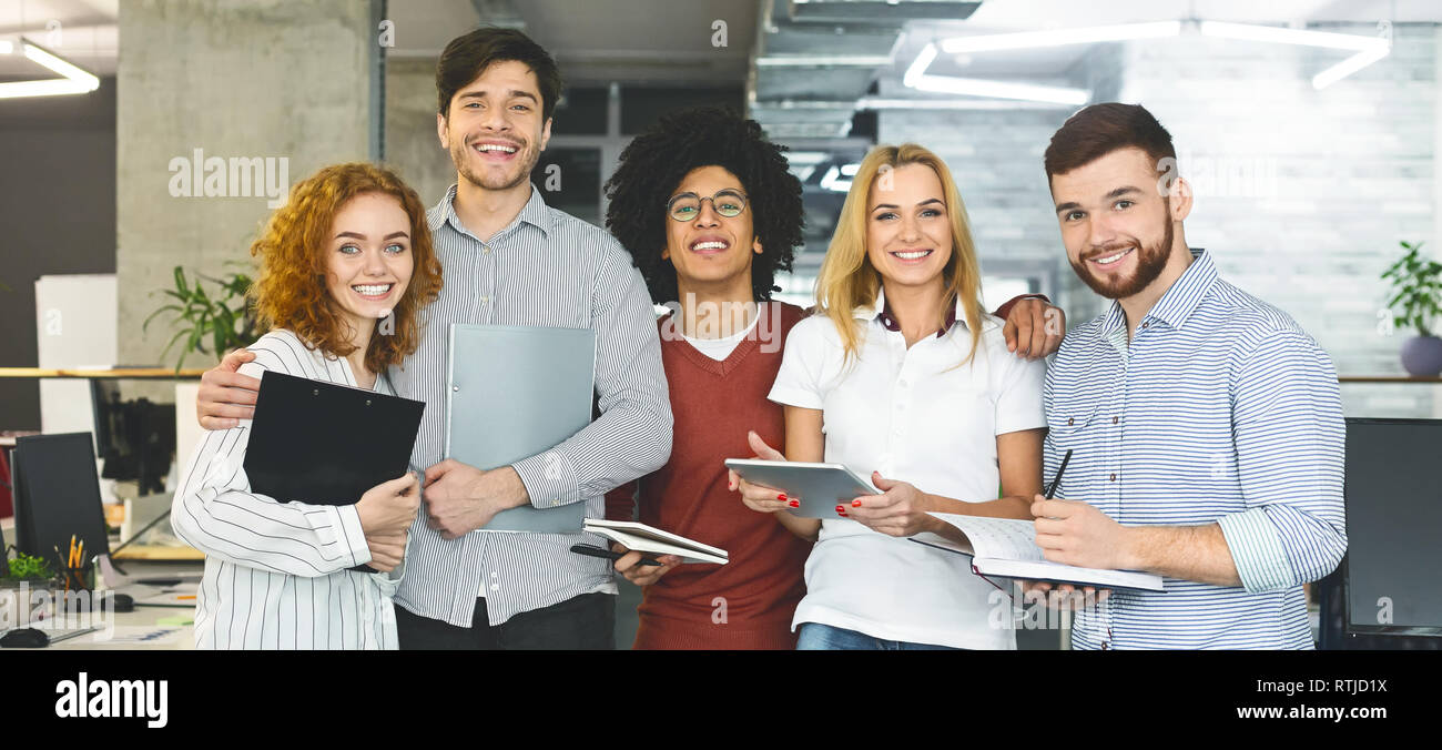 Diverse business people standing together and smiling Stock Photo - Alamy
