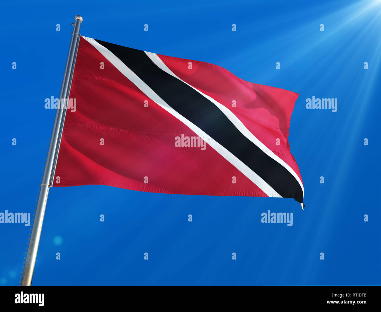 Trinidad And Tobago National Flag Waving on pole against deep blue sky ...