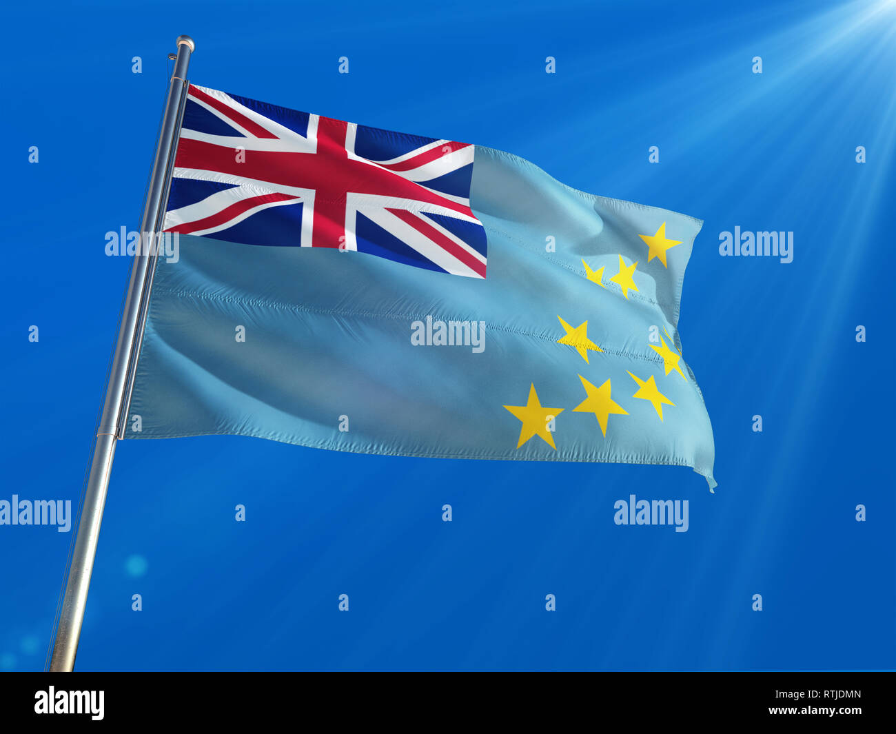 Tuvalu National Flag Waving on pole against deep blue sky background ...