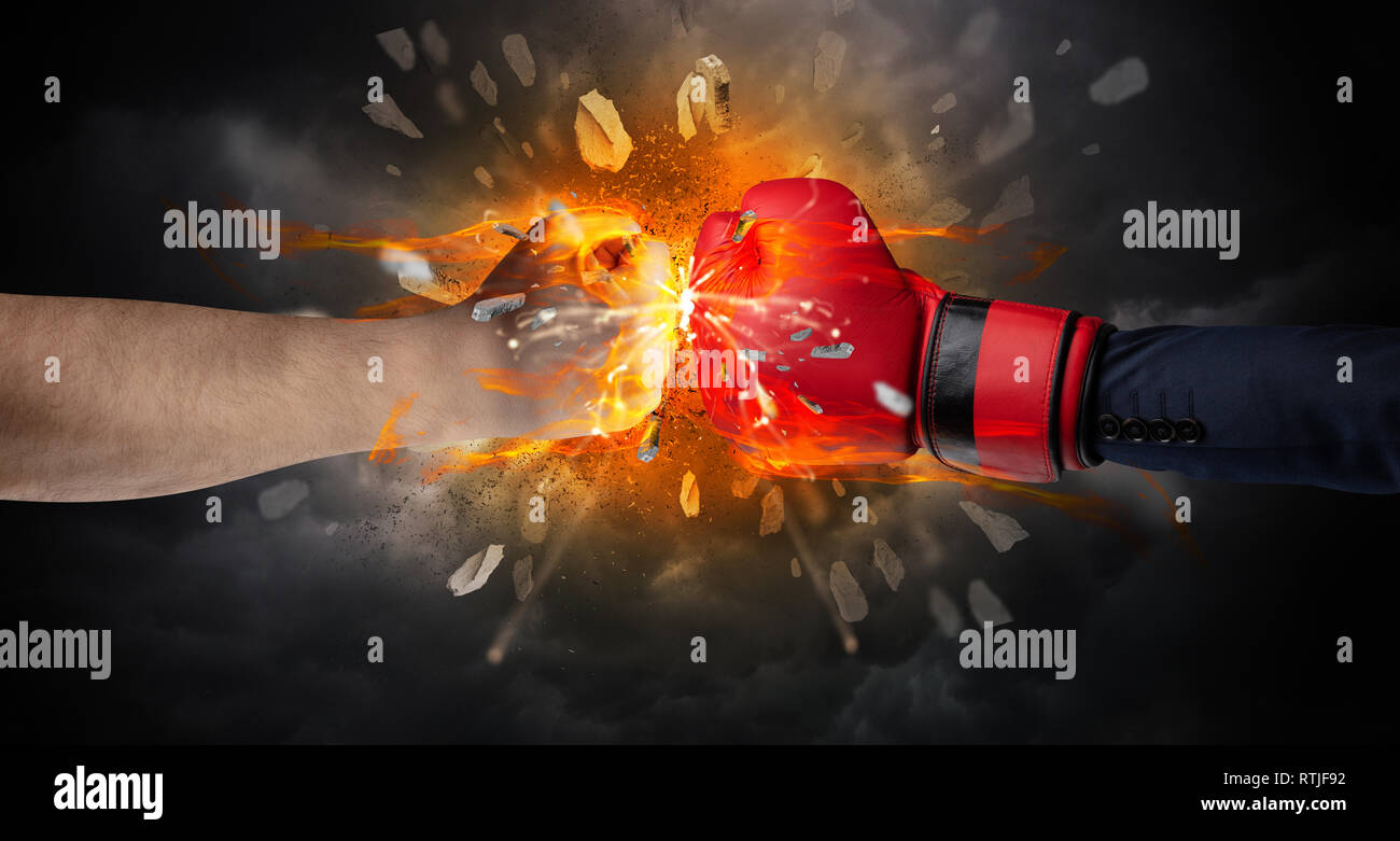 Two hands fighting and breaking a rock into small pieces Stock Photo ...