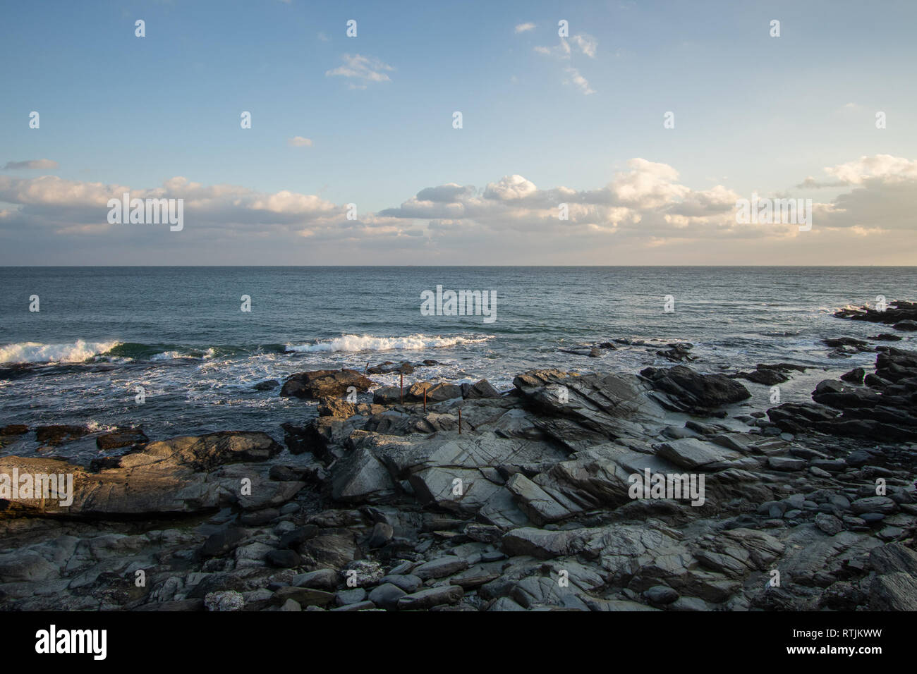 A rocky shoreline during low tide. Taken on a beach in Rhode Island ...