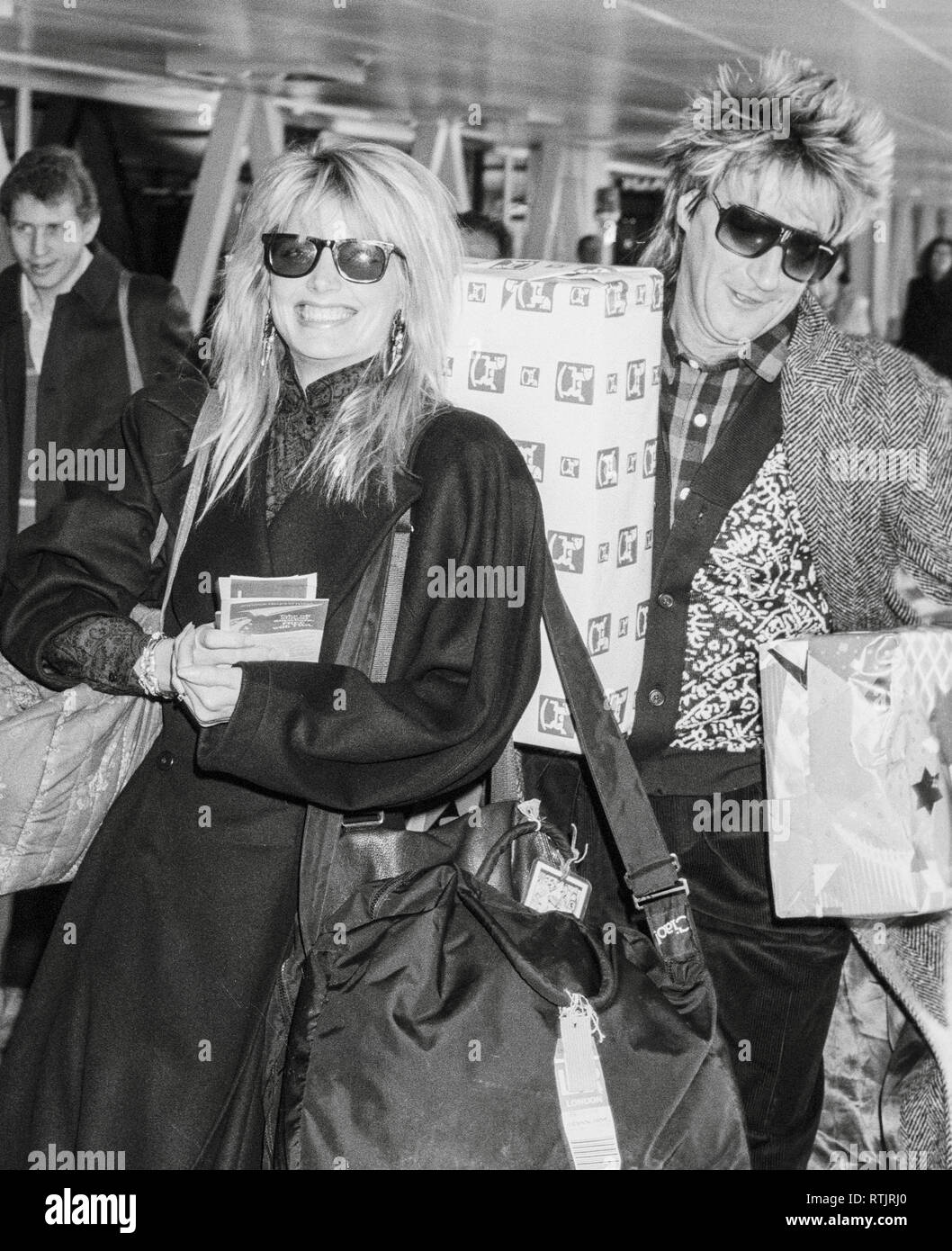 British Rock singer Rod Stewart and girlfriend Kelly Emberg at Heathrow ...