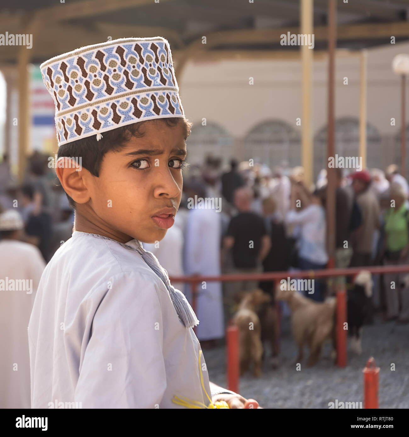Nizwa, Oman - November 2, 2018: Portrait of child turning around ...