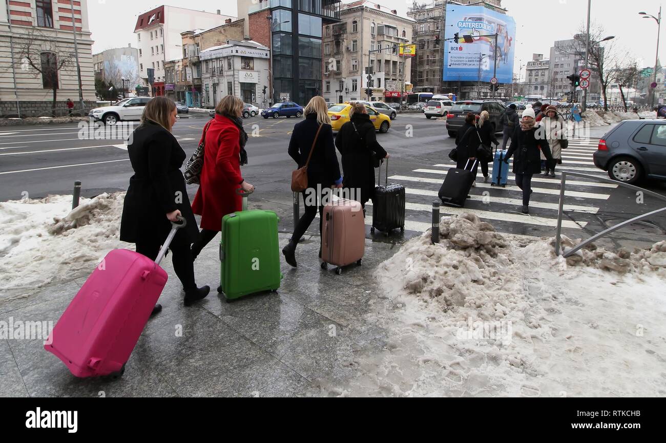 Bucharest, Romania - March 25, 2018: A group of women tourists carrying ...
