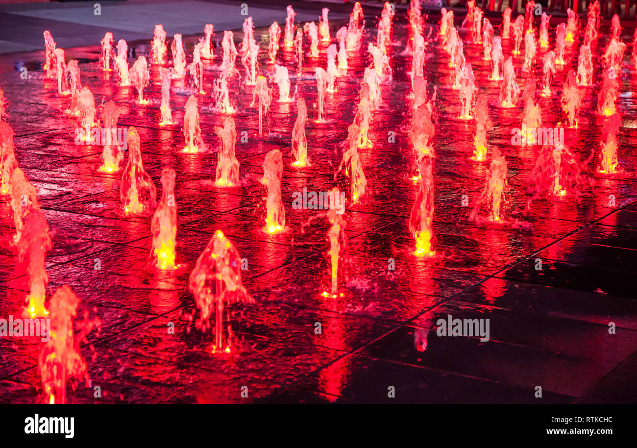 night red water fountain light illumination display in summer landscape ...