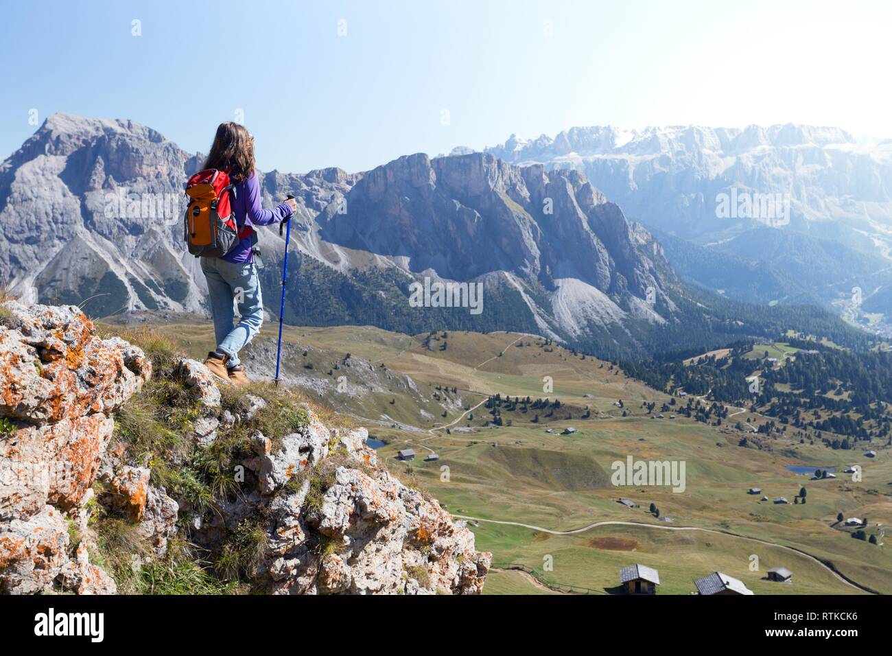 girl hiker at the mountains Dolomites and views of the valley, Italy ...