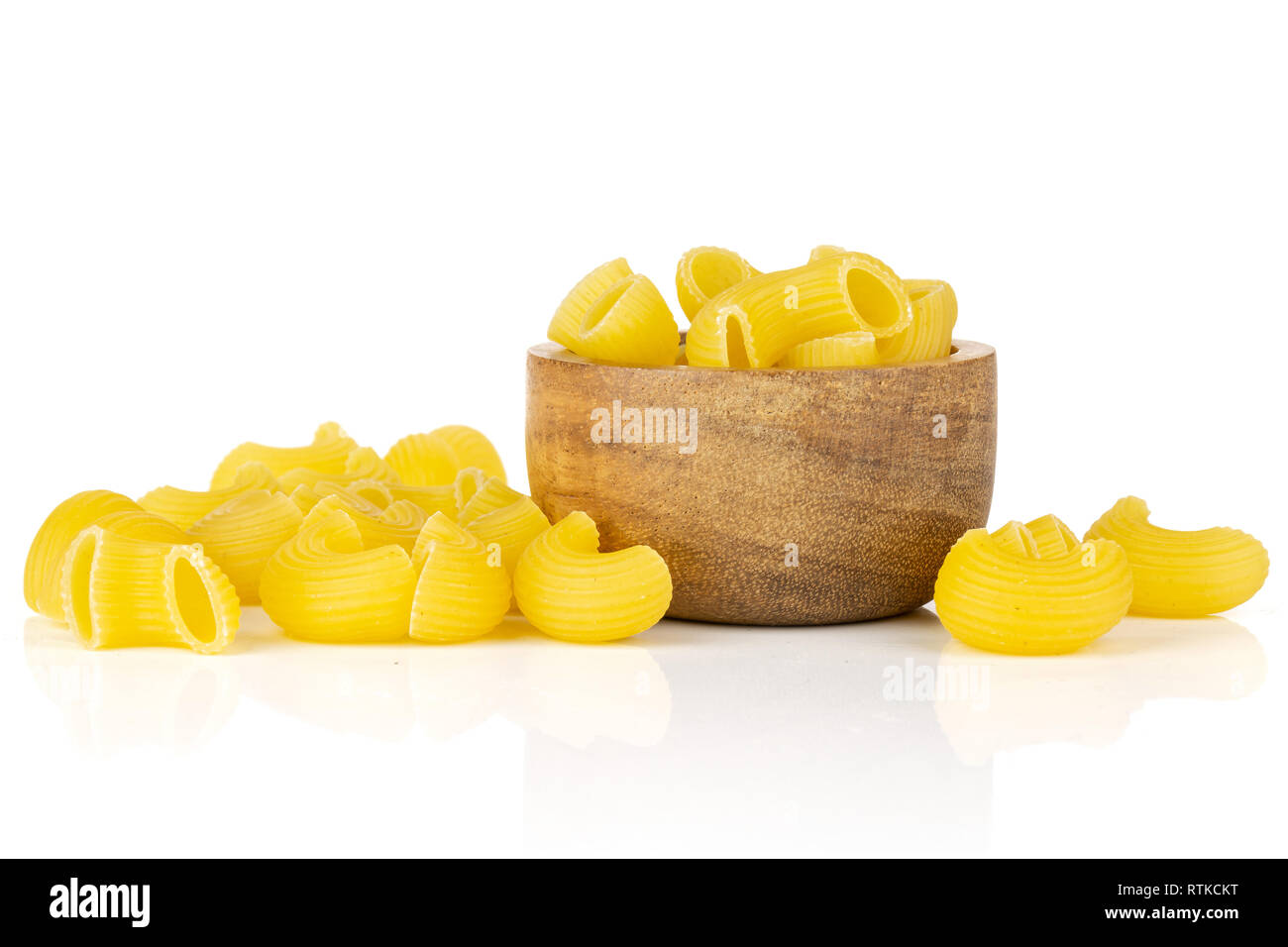 Lot of whole raw pasta pipe rigate variety stack with wooden bowl ...