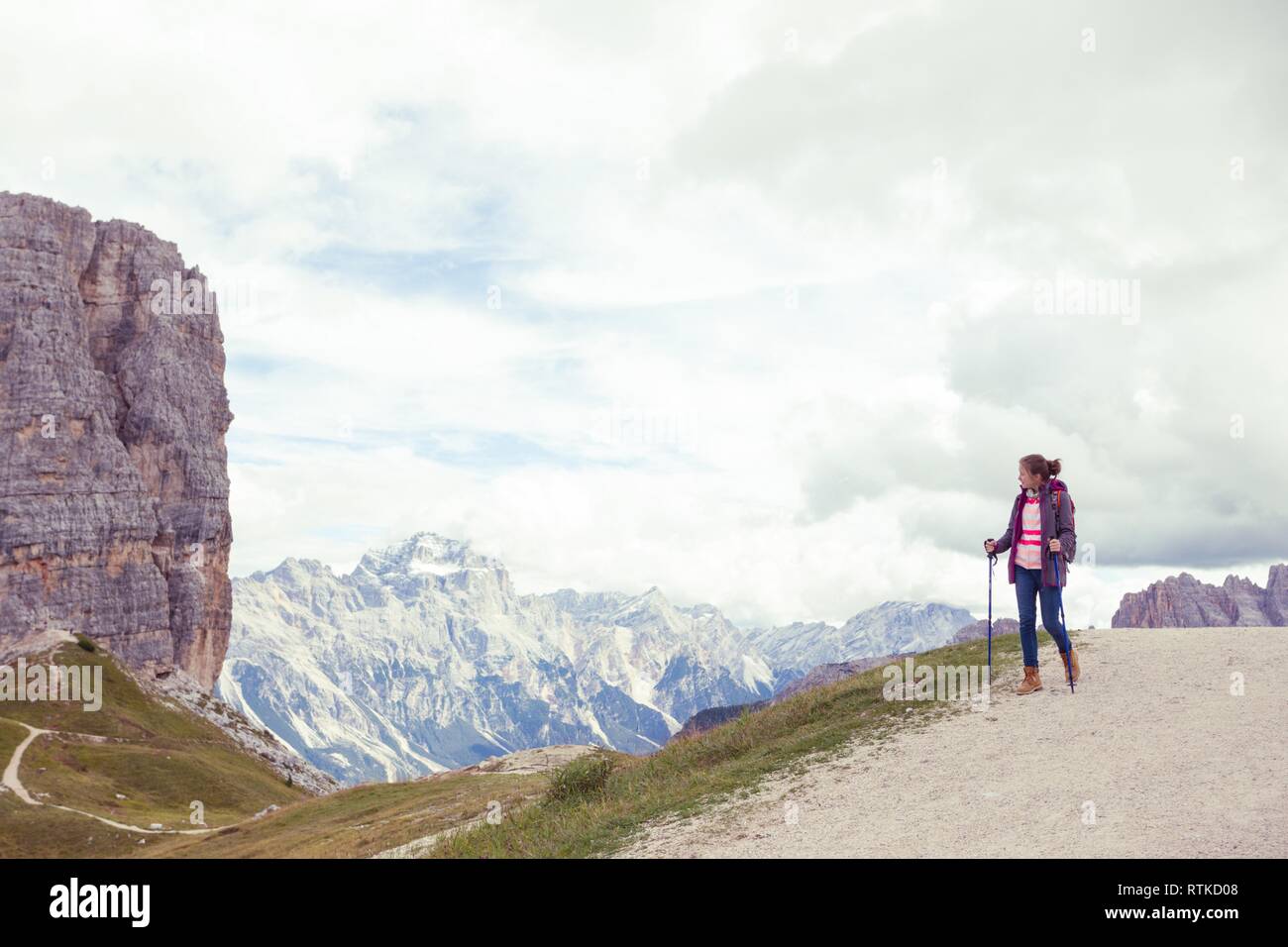 girl hiker at the mountains Dolomites, Italy. Cinque Torri Stock Photo ...