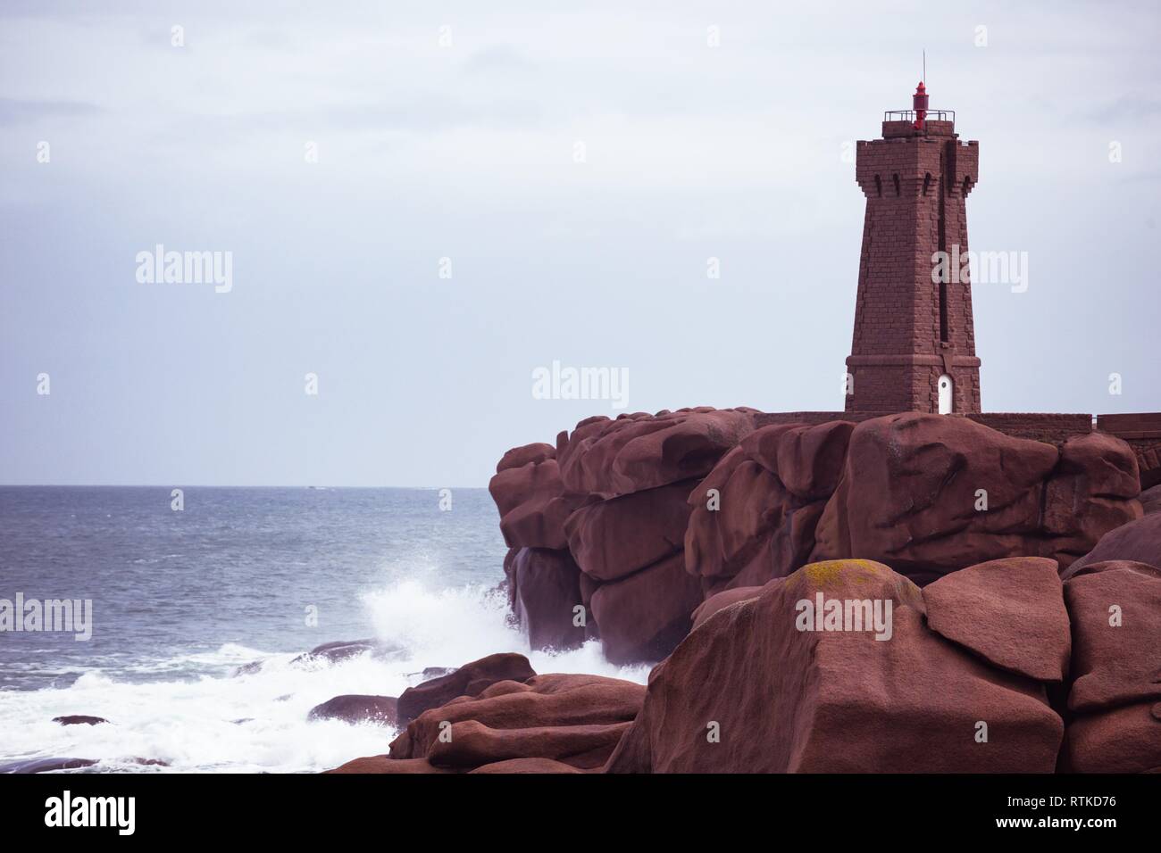 lighthouse Phare de Men Ruz and typical Brittany coast at the Tregastel ...