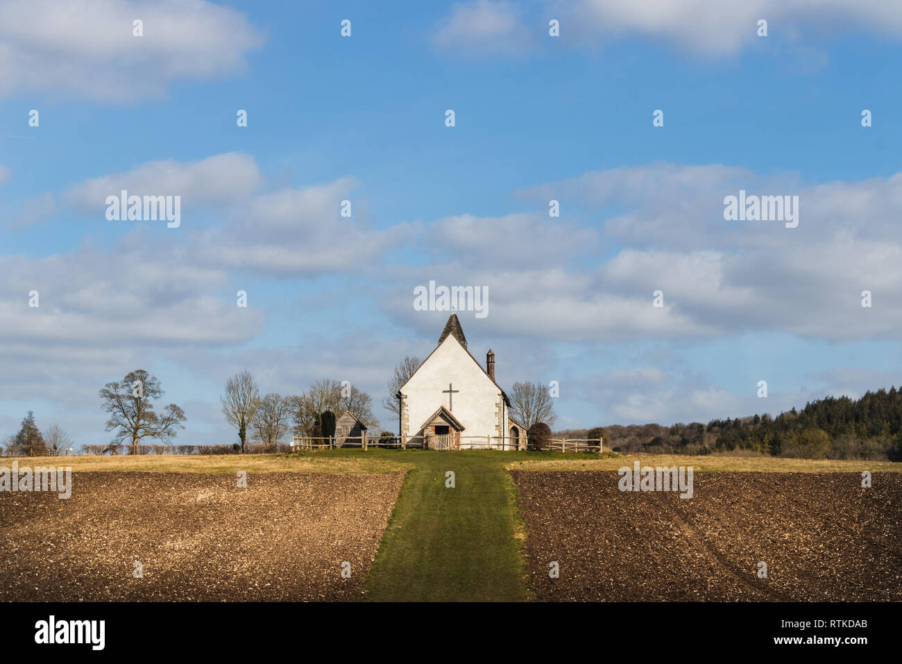Brown Fields leading to St Hubert's church, Idsworth Stock Photo - Alamy