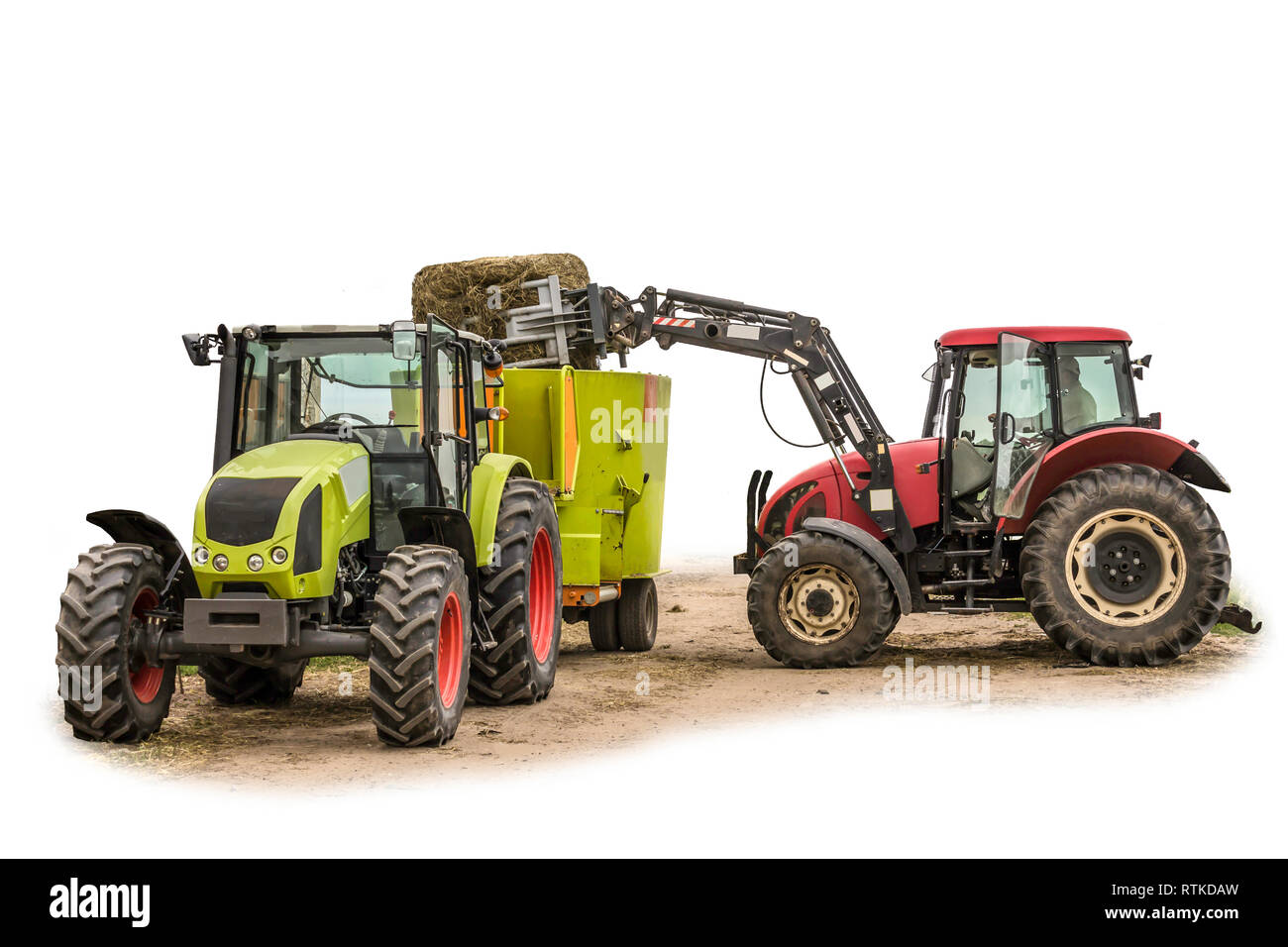 Farmer lifting bale straw tractor Cut Out Stock Images & Pictures - Alamy