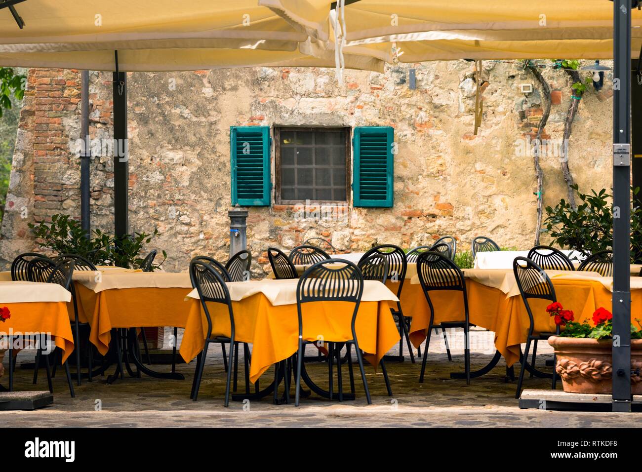 tables and chairs of street cafe at the Italy. Tuscan Stock Photo - Alamy