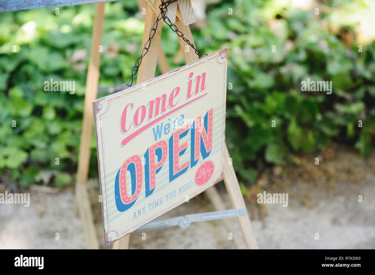 Trade sign indicating that it is open, outdoors on a background of ...