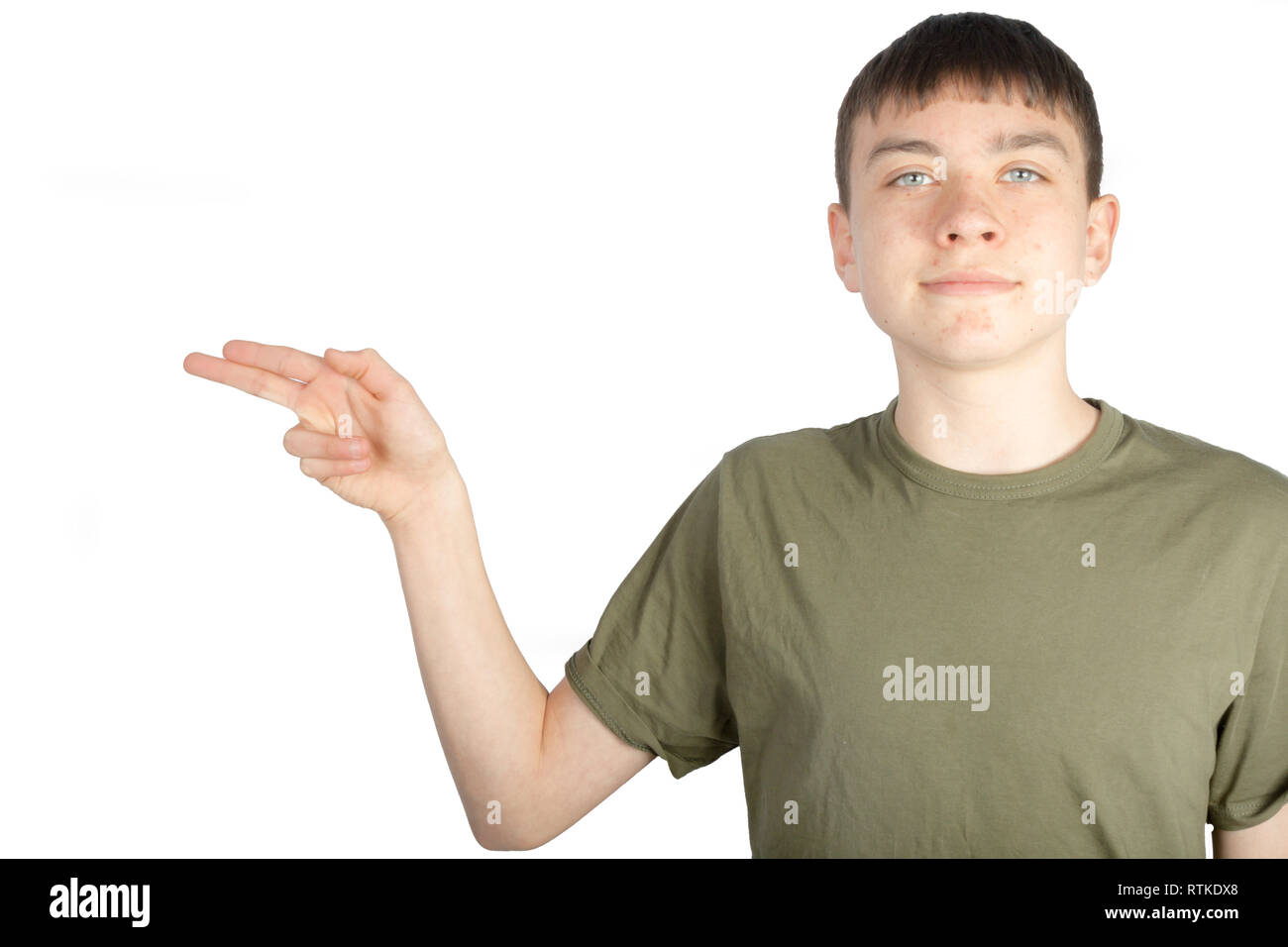 Caucasian teenage boy doing American Sign Language on one hand showing ...
