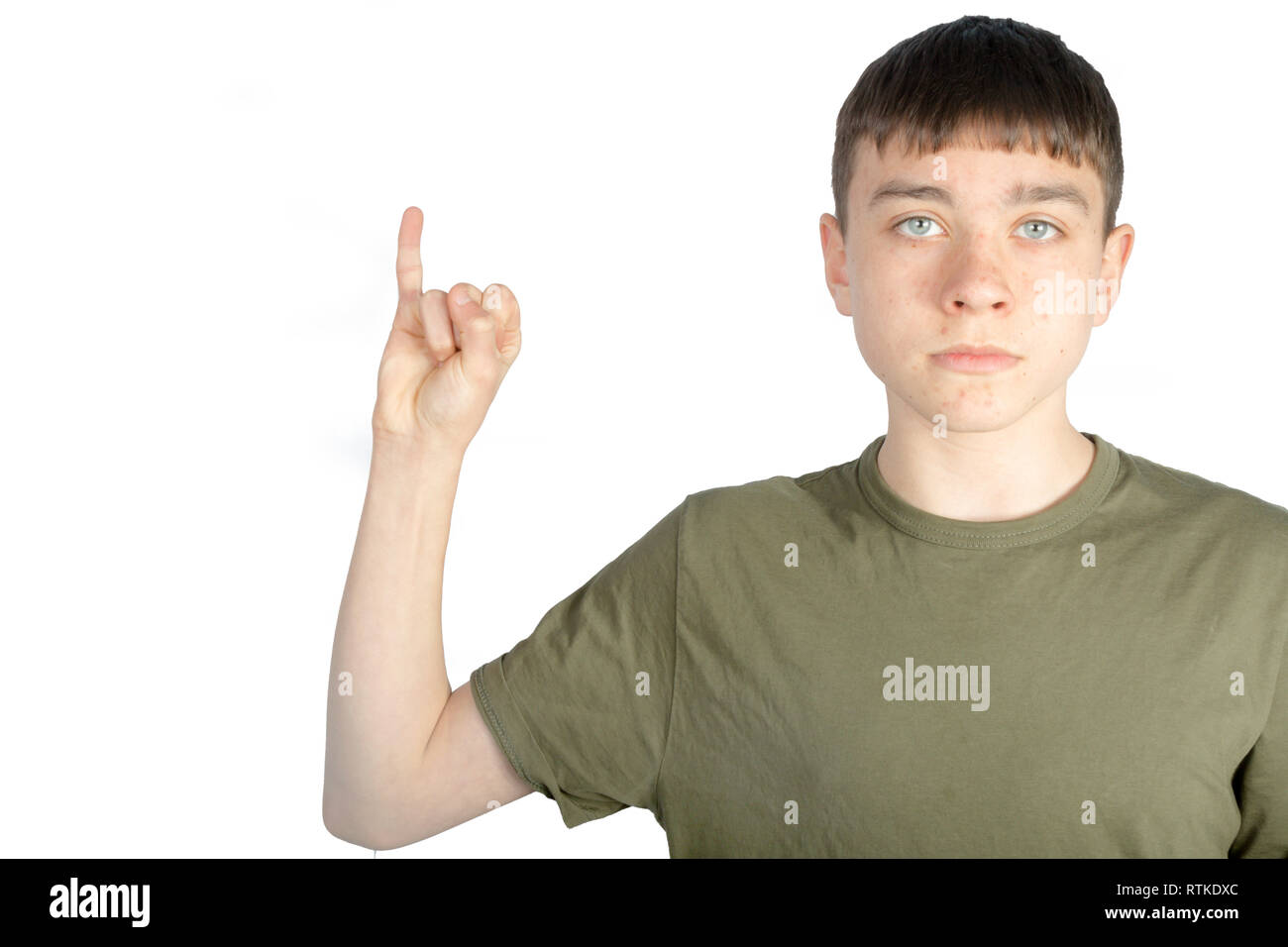 Caucasian teenage boy doing American Sign Language on one hand showing ...