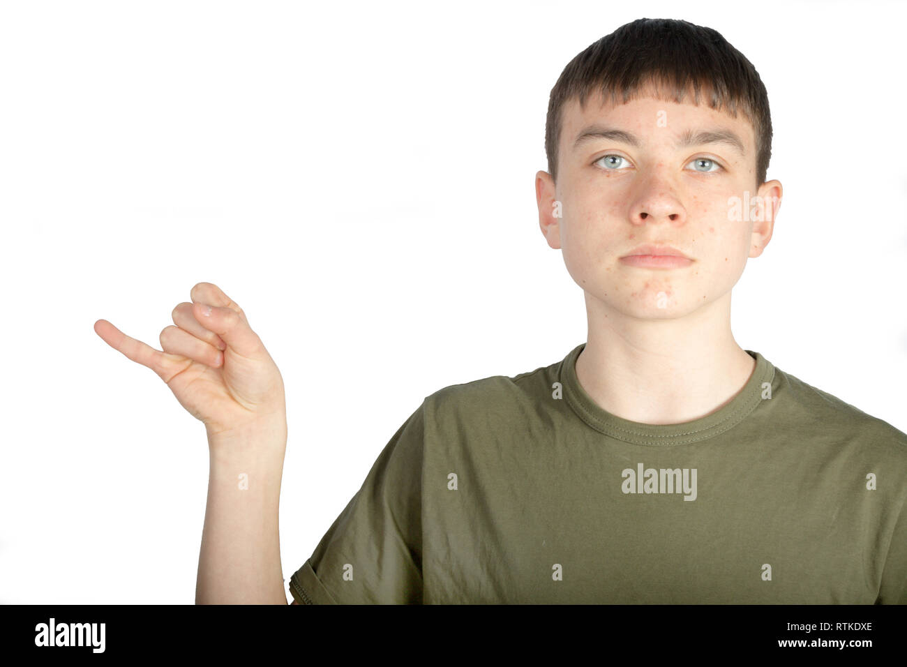 Caucasian teenage boy doing American Sign Language on one hand showing ...