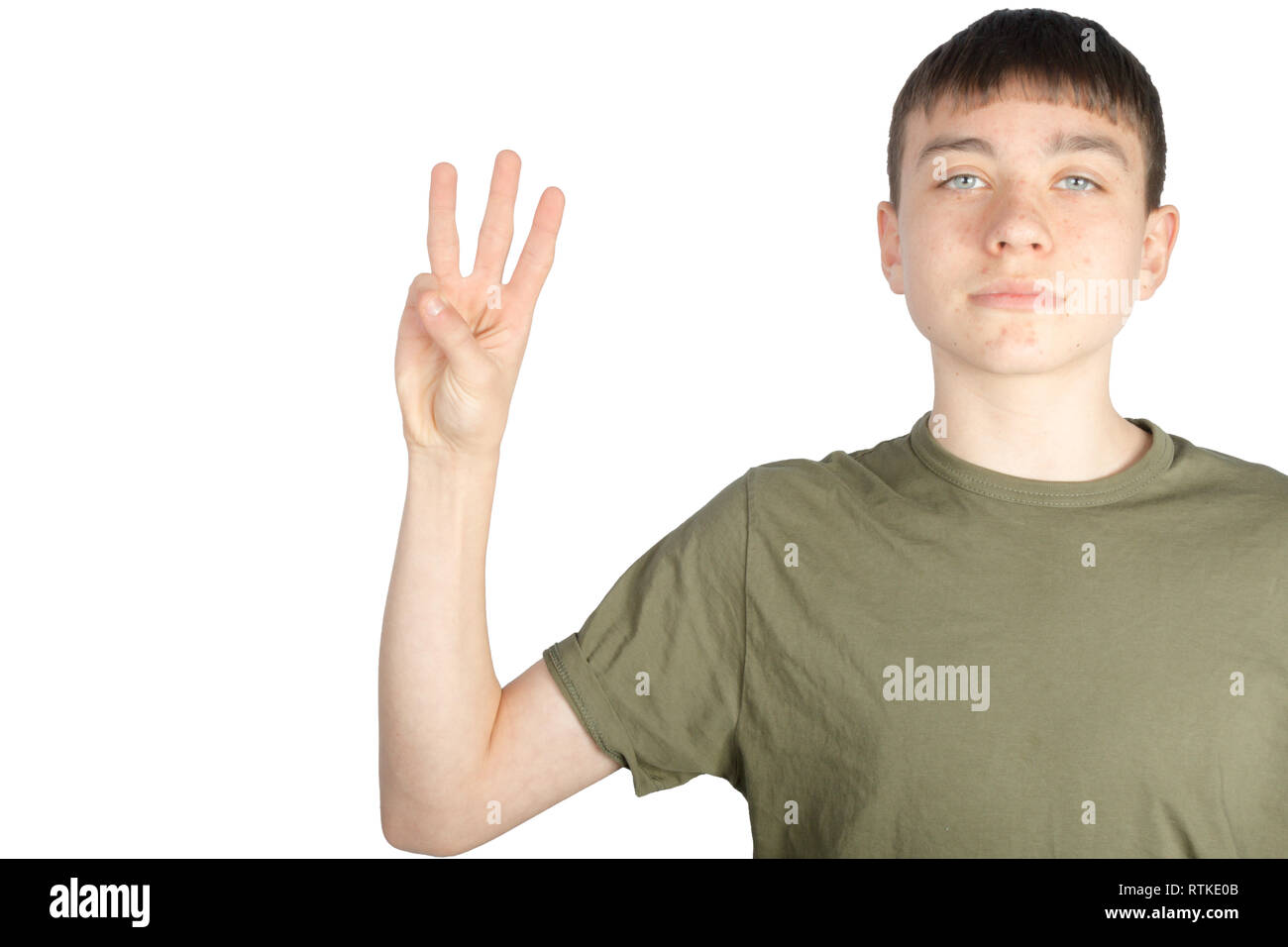 Caucasian teenage boy doing American Sign Language on one hand showing ...