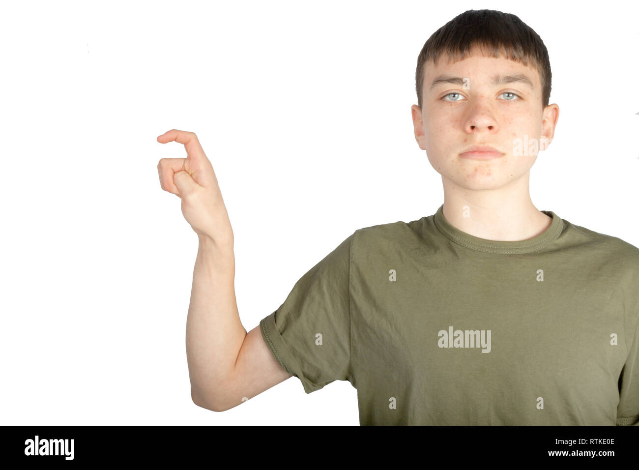 Caucasian teenage boy doing American Sign Language on one hand showing ...