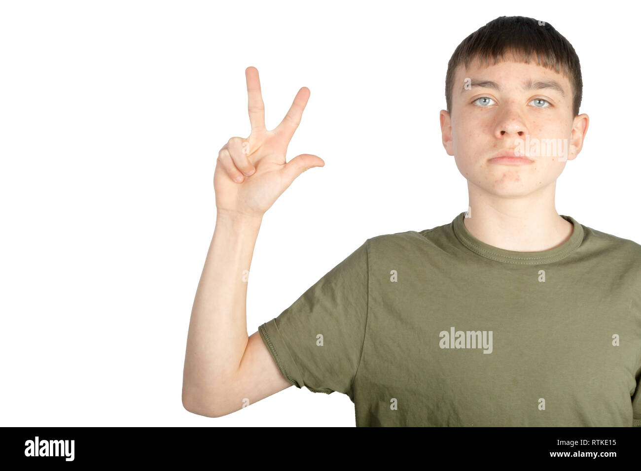 Caucasian teenage boy doing American Sign Language on one hand showing ...