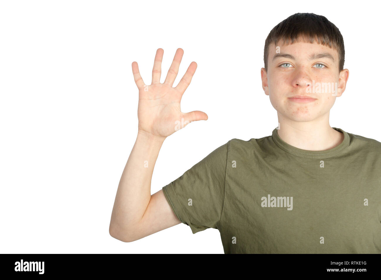 Caucasian teenage boy doing American Sign Language on one hand showing ...