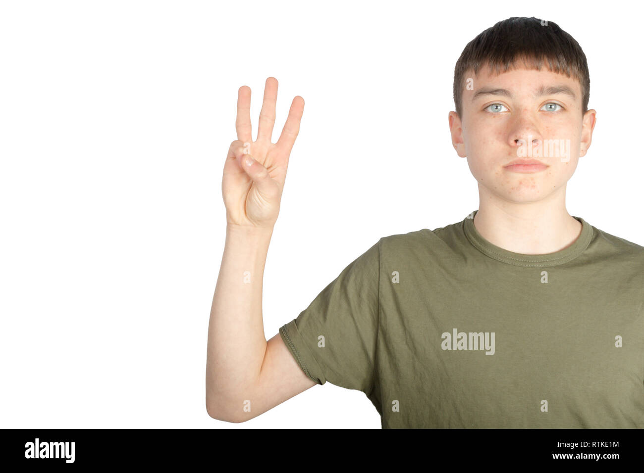 Caucasian teenage boy doing American Sign Language on one hand showing ...