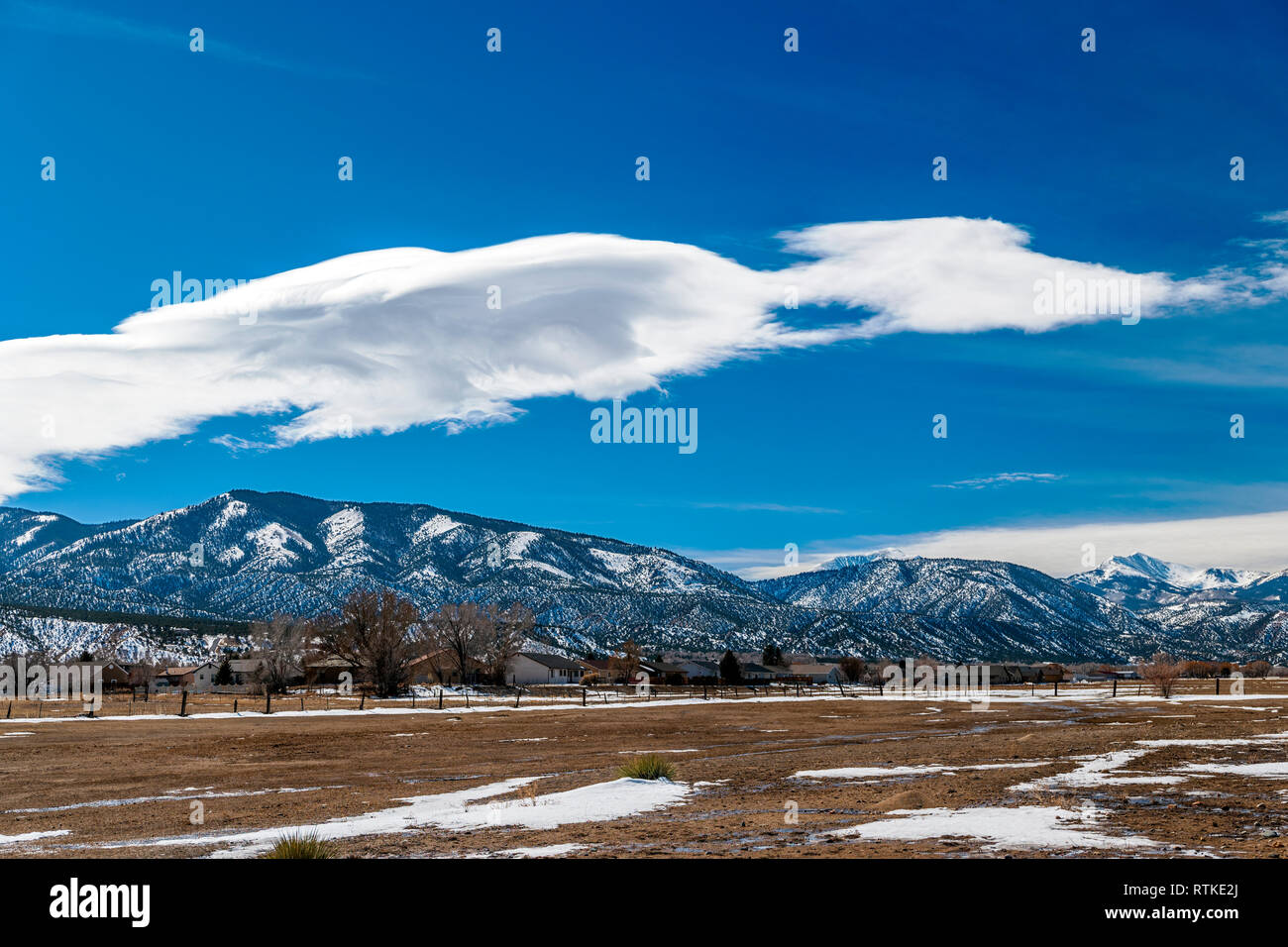 Unusual cloud formations against cobalt blue sky over Rocky Mountains ...