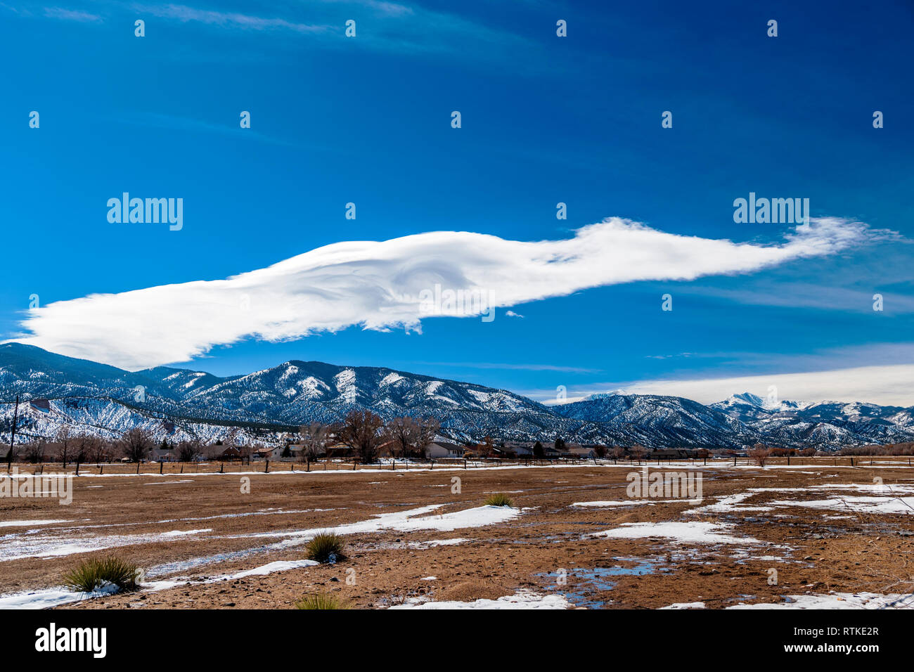 Unusual cloud formations against cobalt blue sky over Rocky Mountains ...